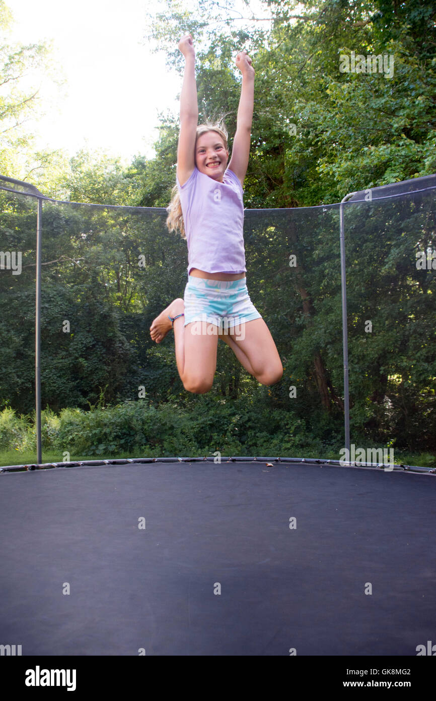 Young girl jumping on trampoline Stock Photo - Alamy Young girl jumping on trampoline Stock Photo - Alamy
