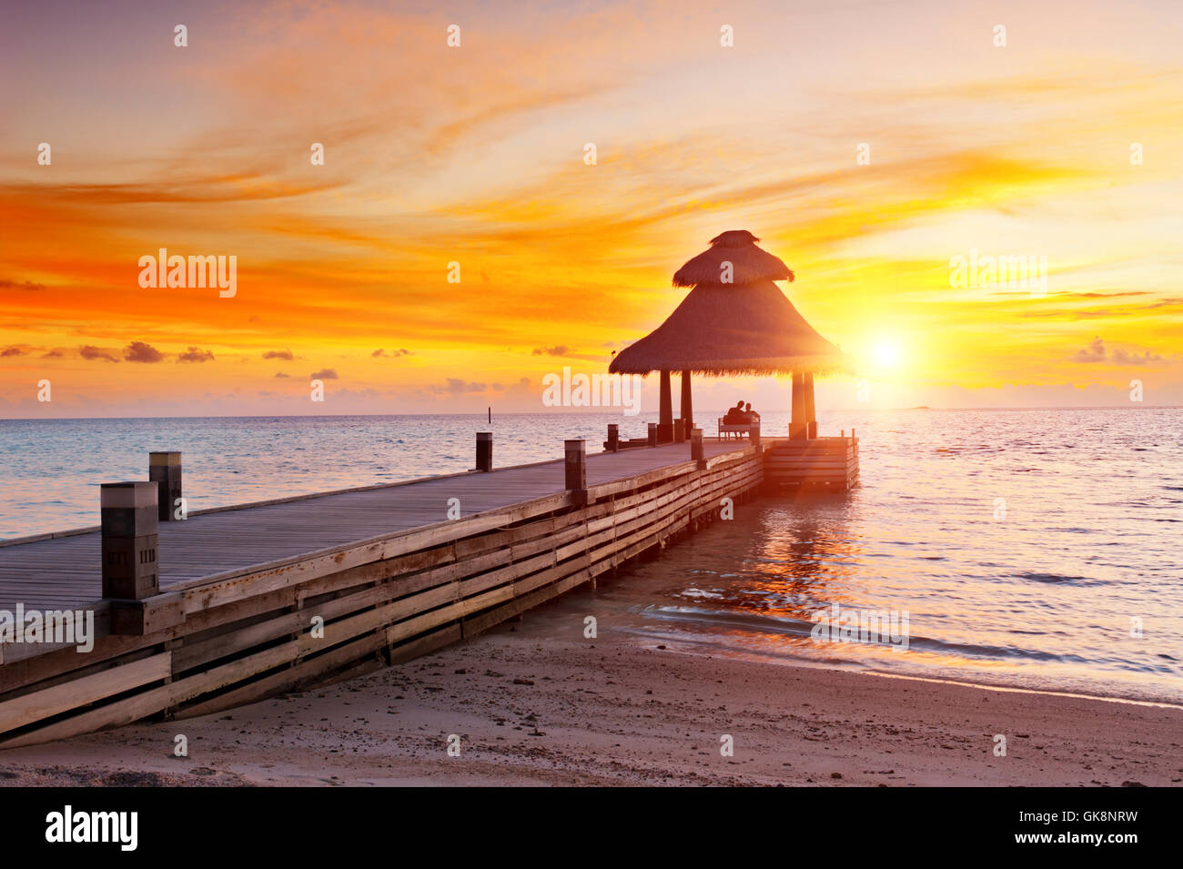 sunset maldives jetty Stock Photo - Alamy