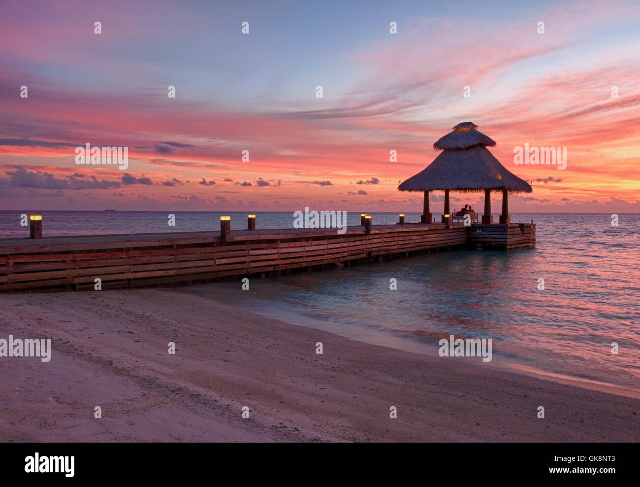 sunset maldives jetty Stock Photo - Alamy