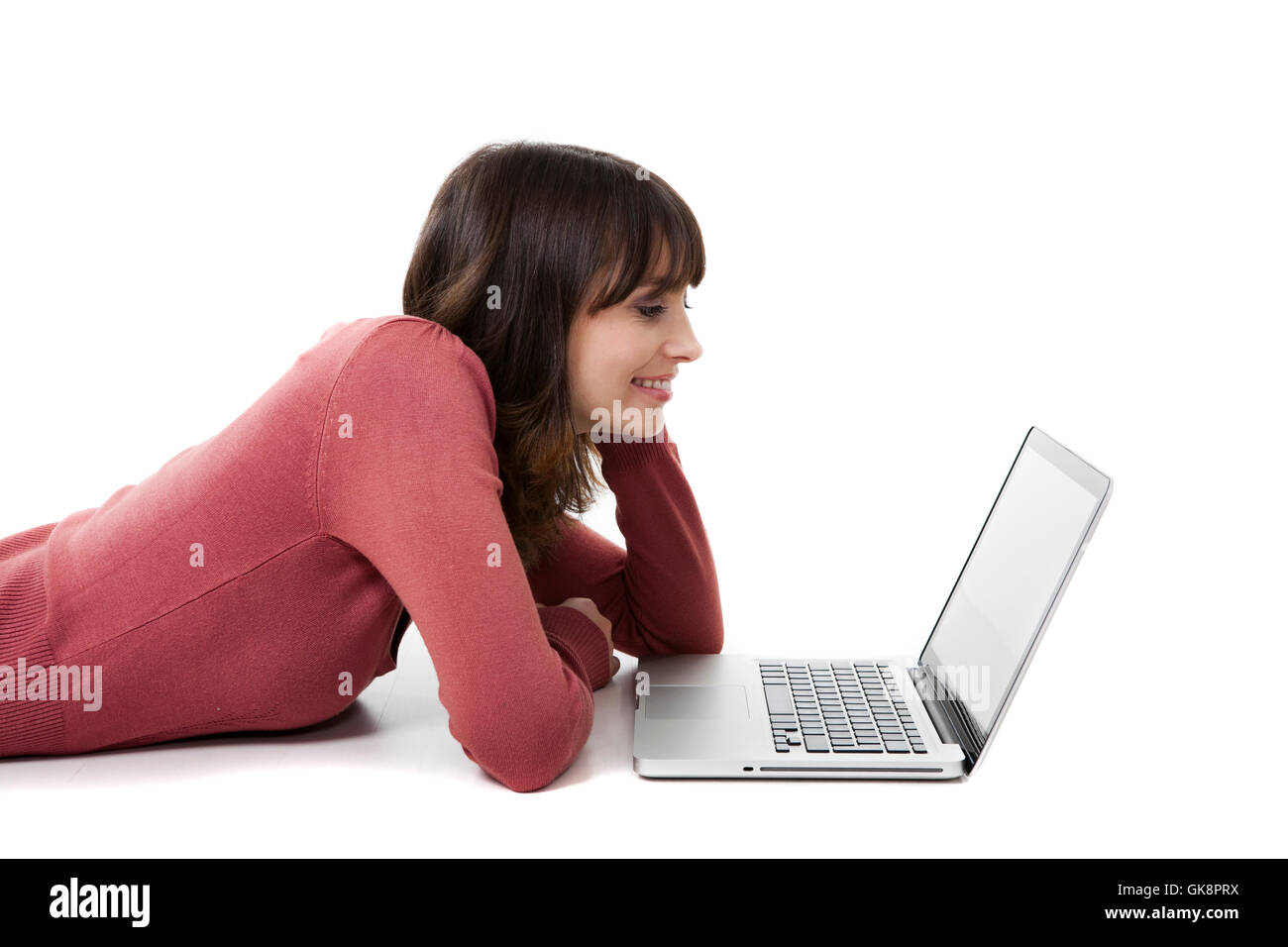 Young woman laptop lying Cut Out Stock Images & Pictures - Alamy