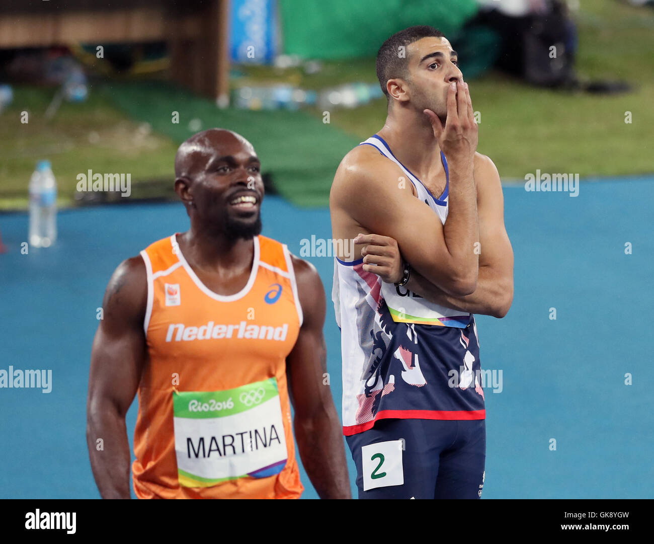 Great Britain's Adam Gemili (right) appears dejected after finishing ...