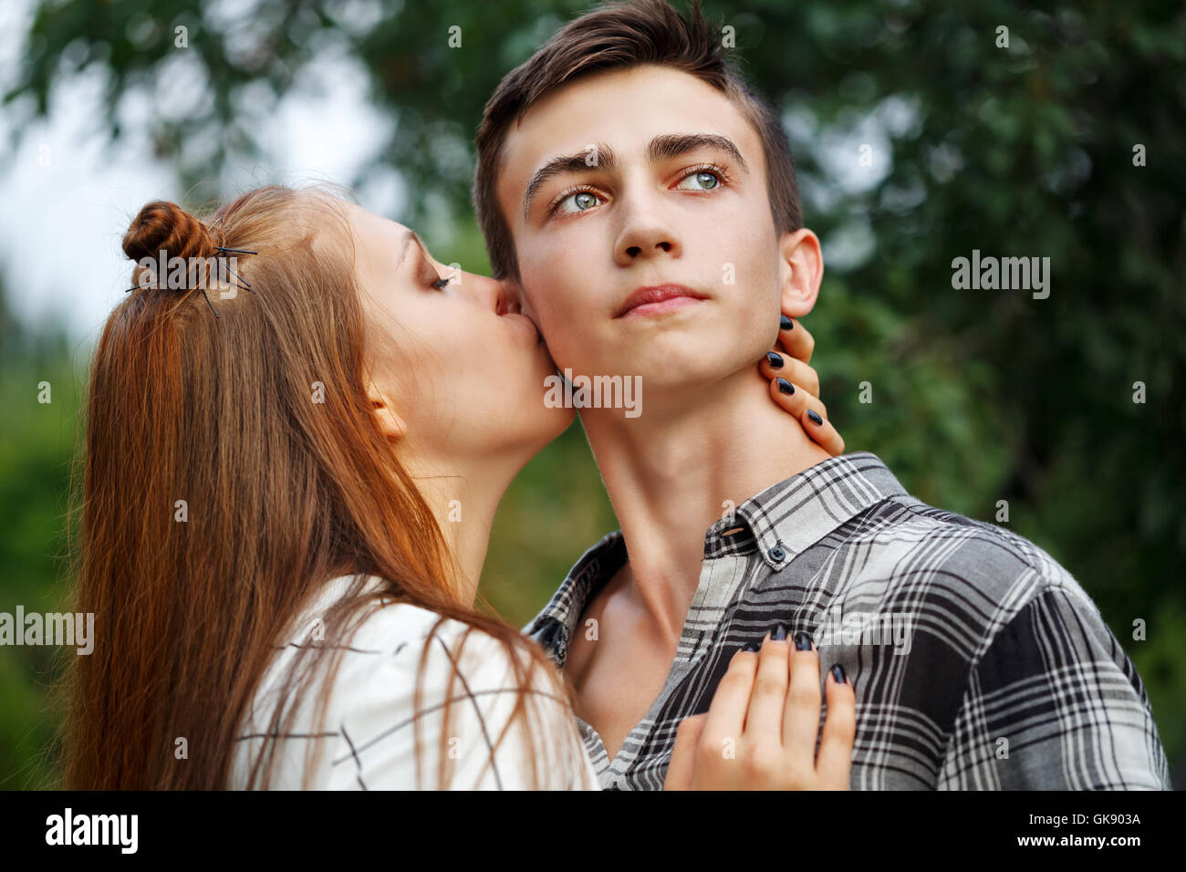 Loving couple teenagers. Girlfriend and boyfriend together. The girl ...