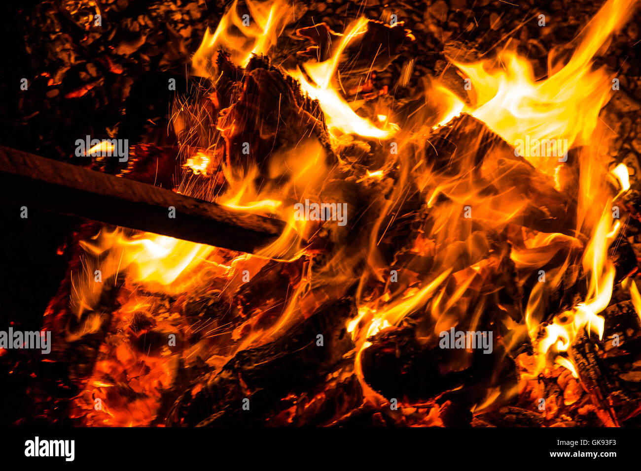 firewood in the bonfire with fire and sparks Stock Photo - Alamy