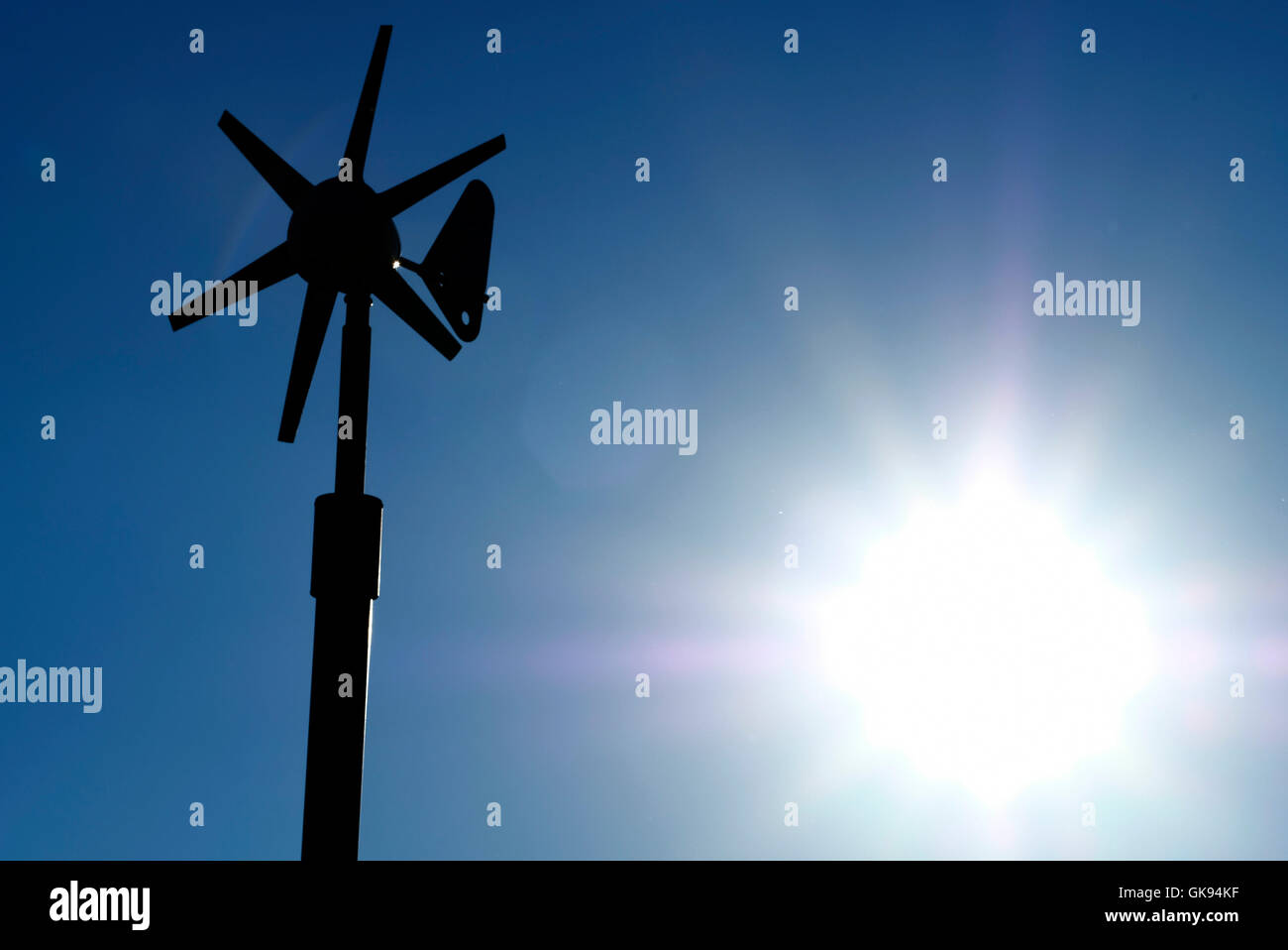 wind and solar turbine and the sun Stock Photo - Alamy
