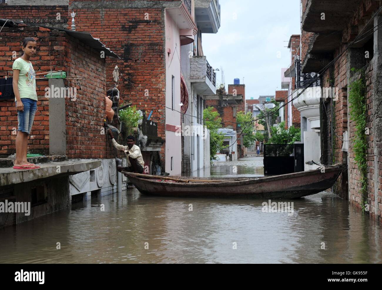 Allahabad, India. 19th Aug, 2016. People shift to a safer place after ...