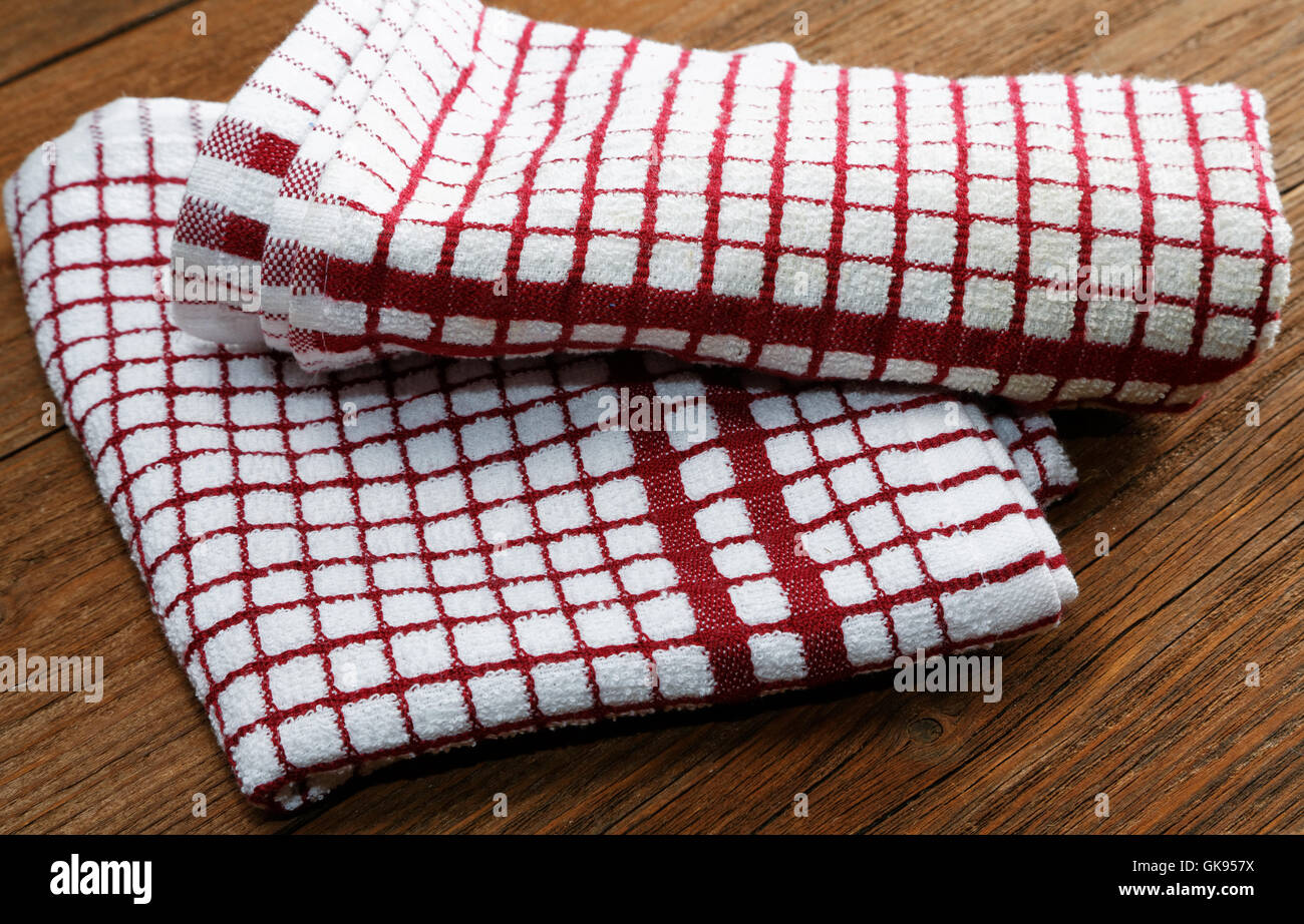 kitchen towels on rustic table Stock Photo - Alamy