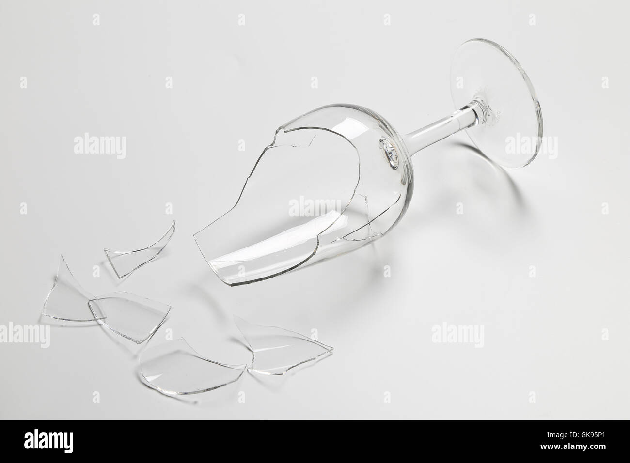 Broken Red Wine tasting glass Stock Photo - Alamy