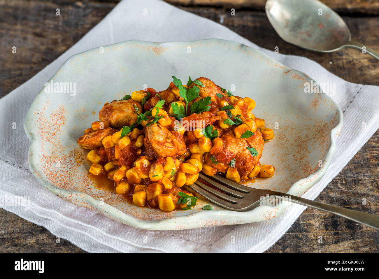 Mexican chicken with sweetcorn and tomato sauce Stock Photo - Alamy