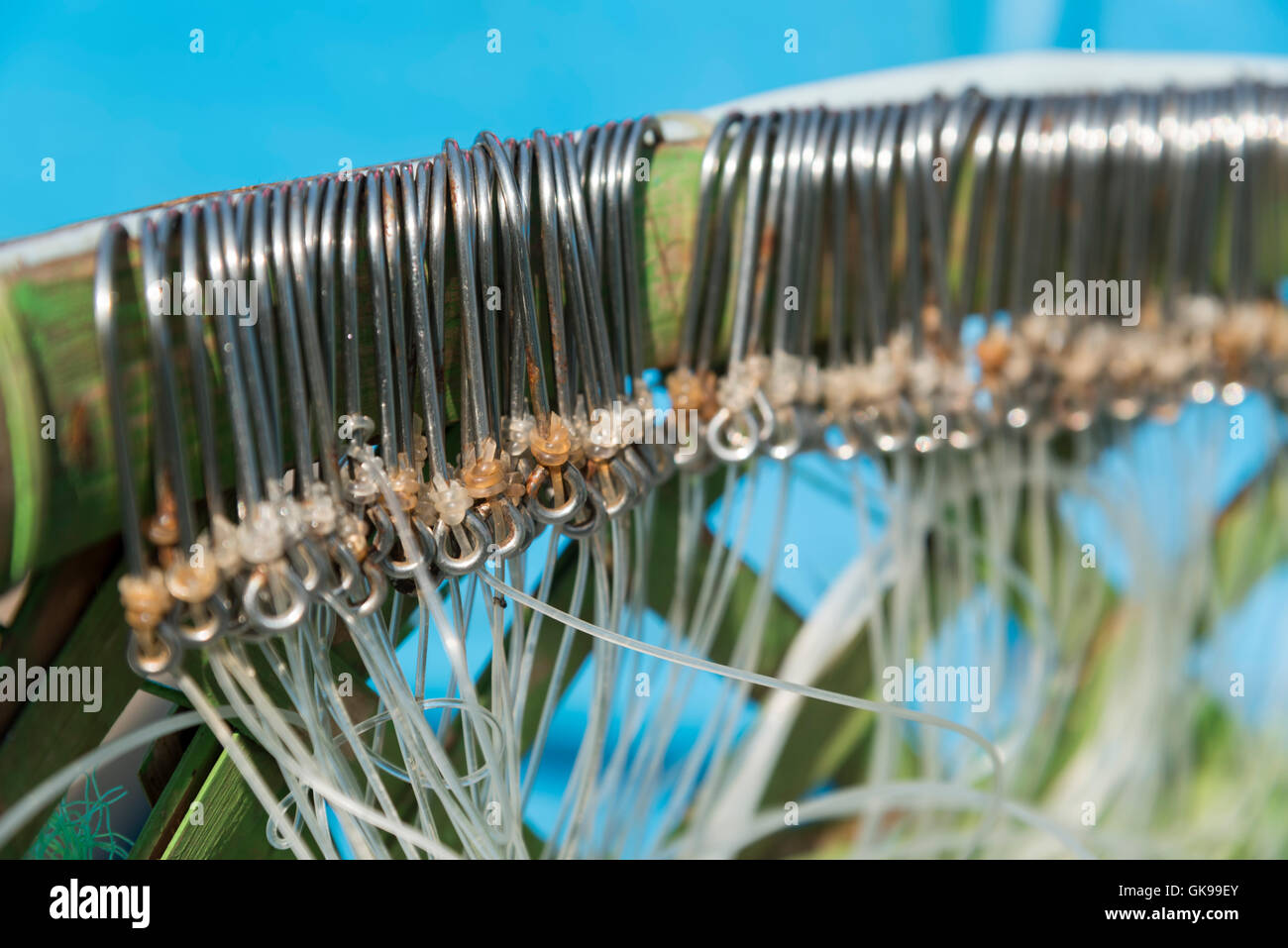many fishing hooks on the net Stock Photo - Alamy