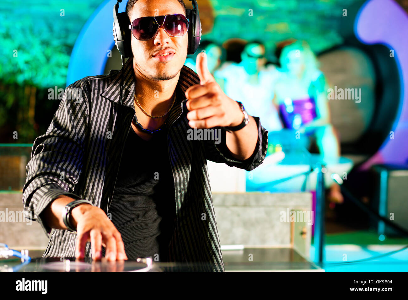 dj club with crowd in background Stock Photo - Alamy