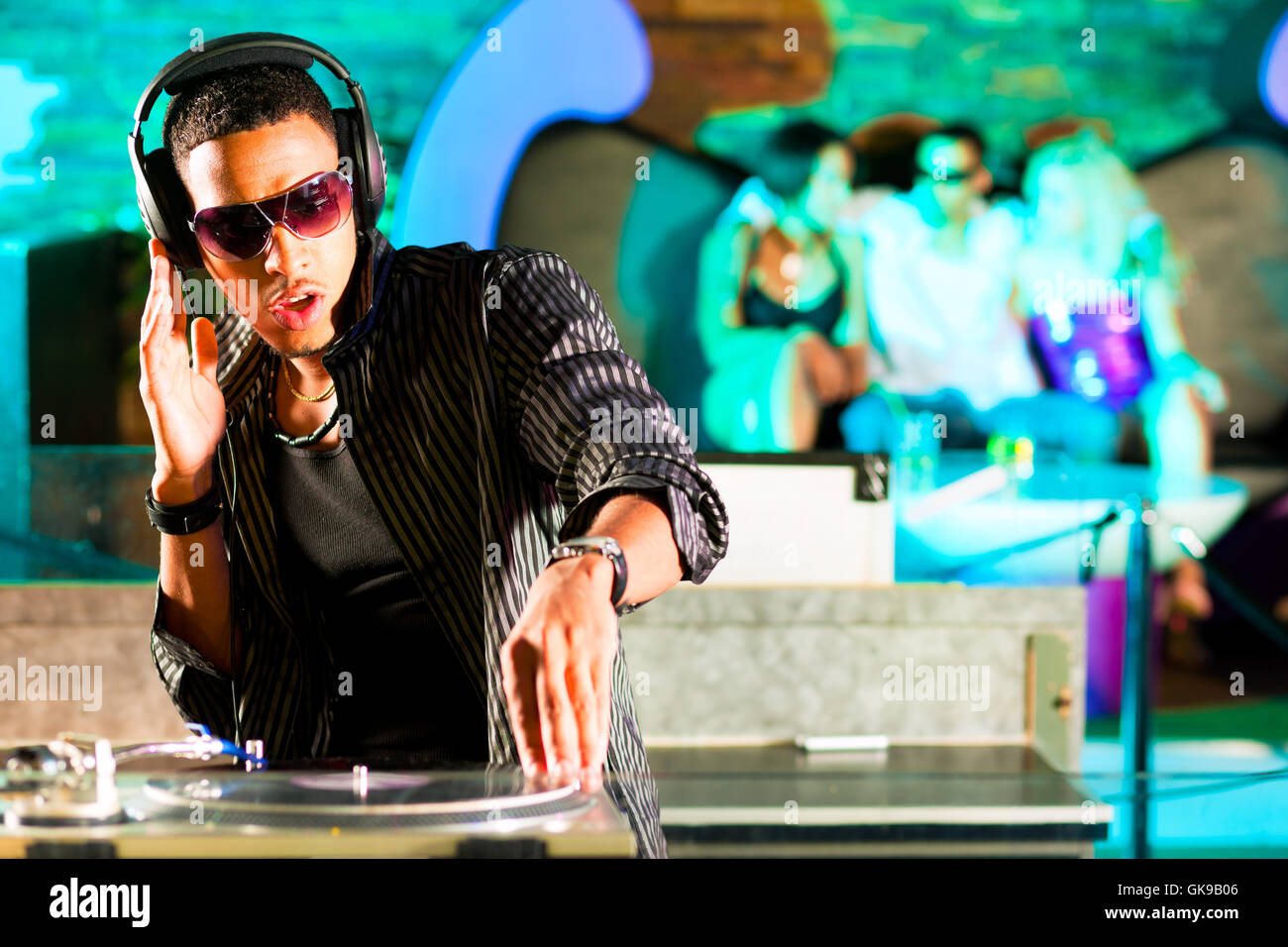 dj club with crowd in background Stock Photo - Alamy