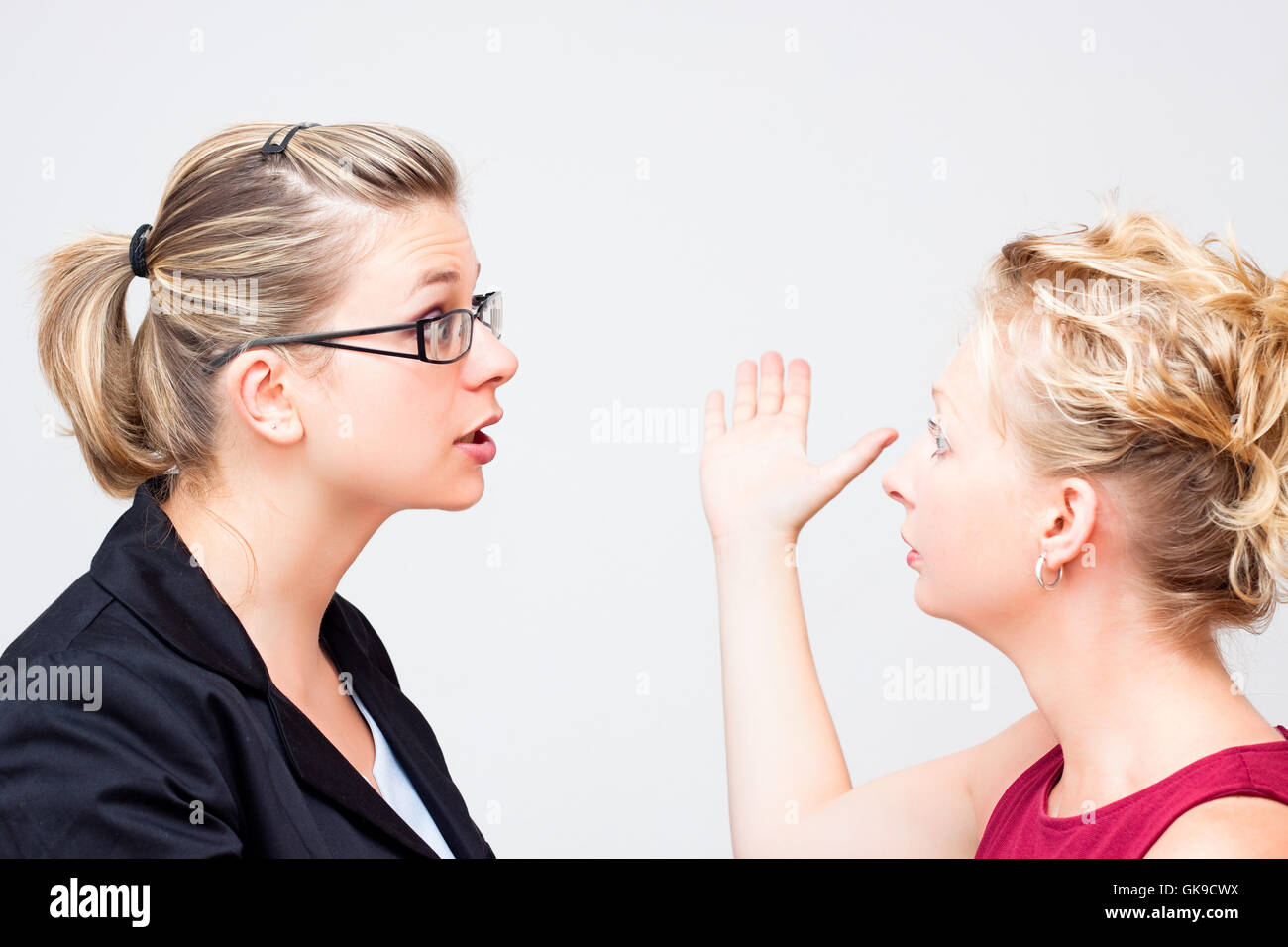 Two young business women fighting hi-res stock photography and images ...