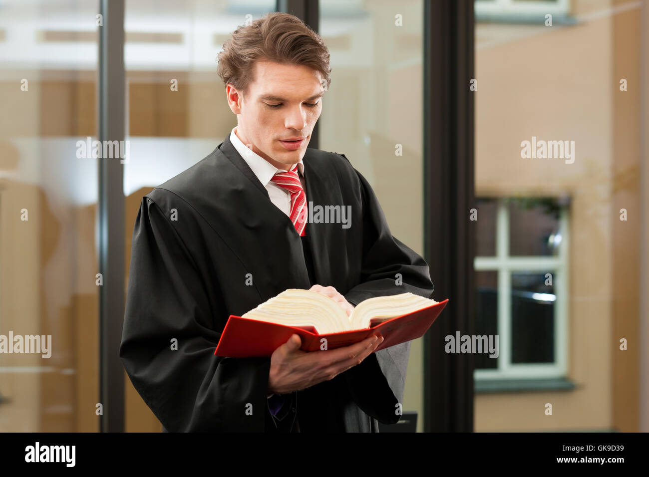lawyer with statute book Stock Photo - Alamy