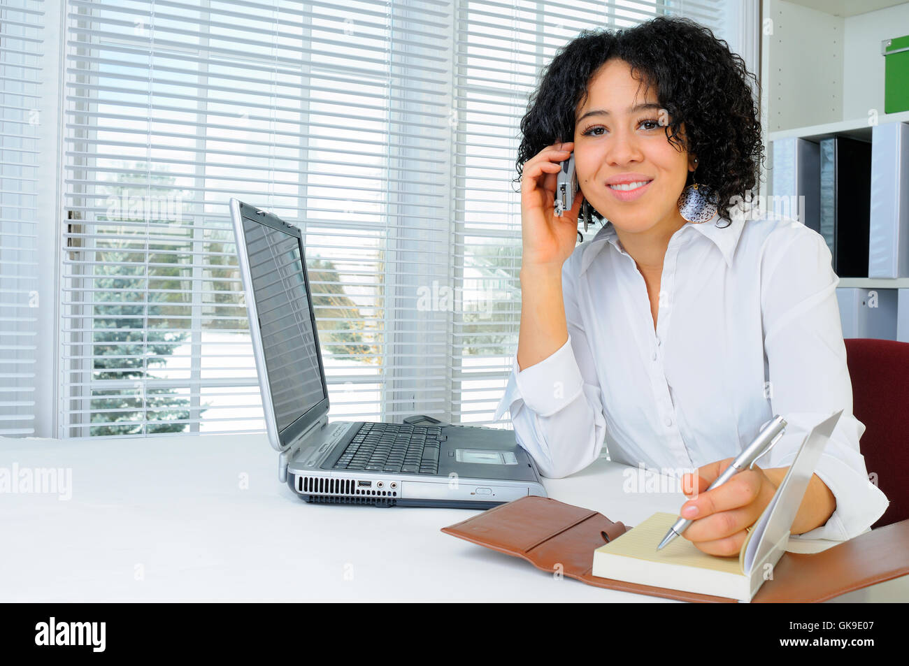 Receptionist laptop writing woman hi-res stock photography and images ...