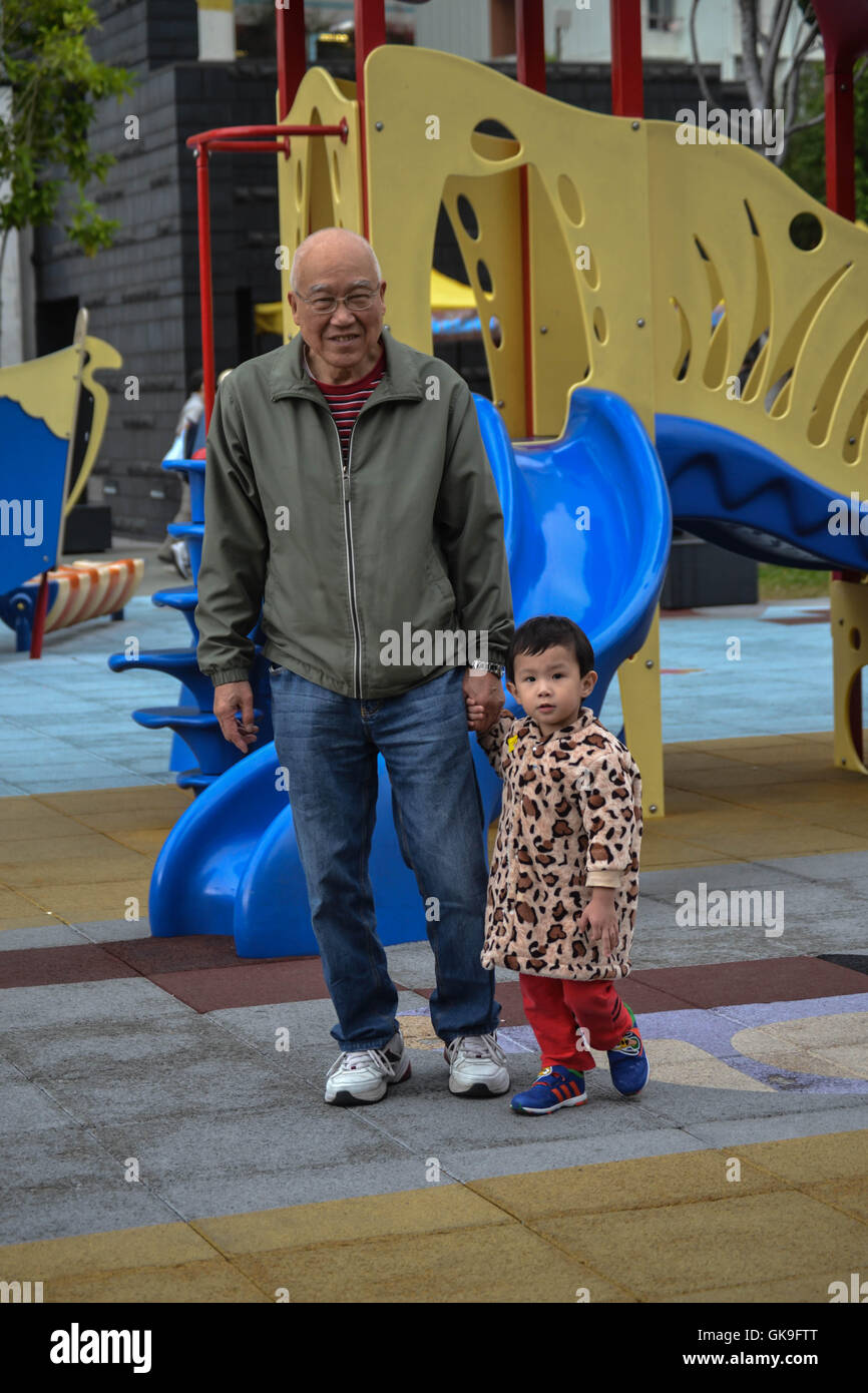 Grandpa and grandson at a park Stock Photo - Alamy