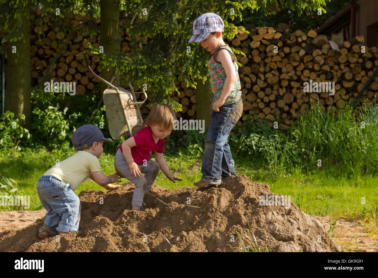 children play in the sand pile Stock Photo - Alamy
