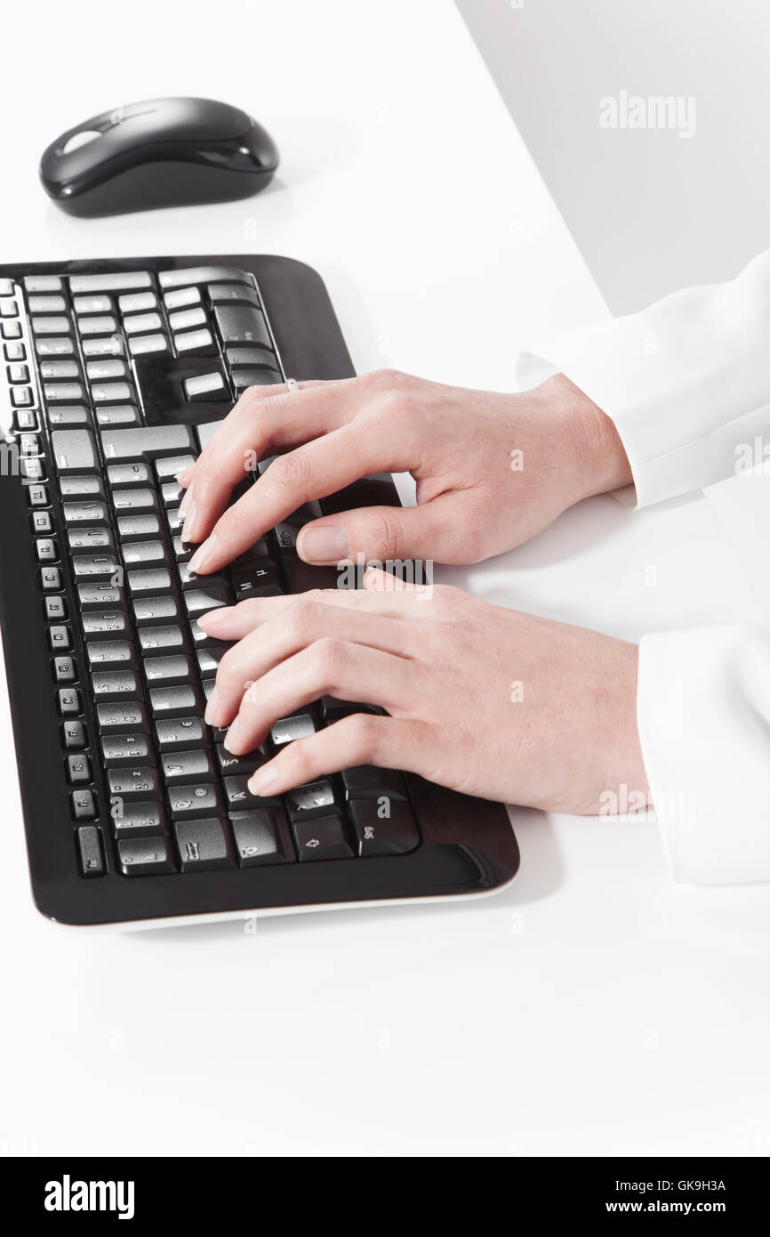 woman office type Stock Photo - Alamy