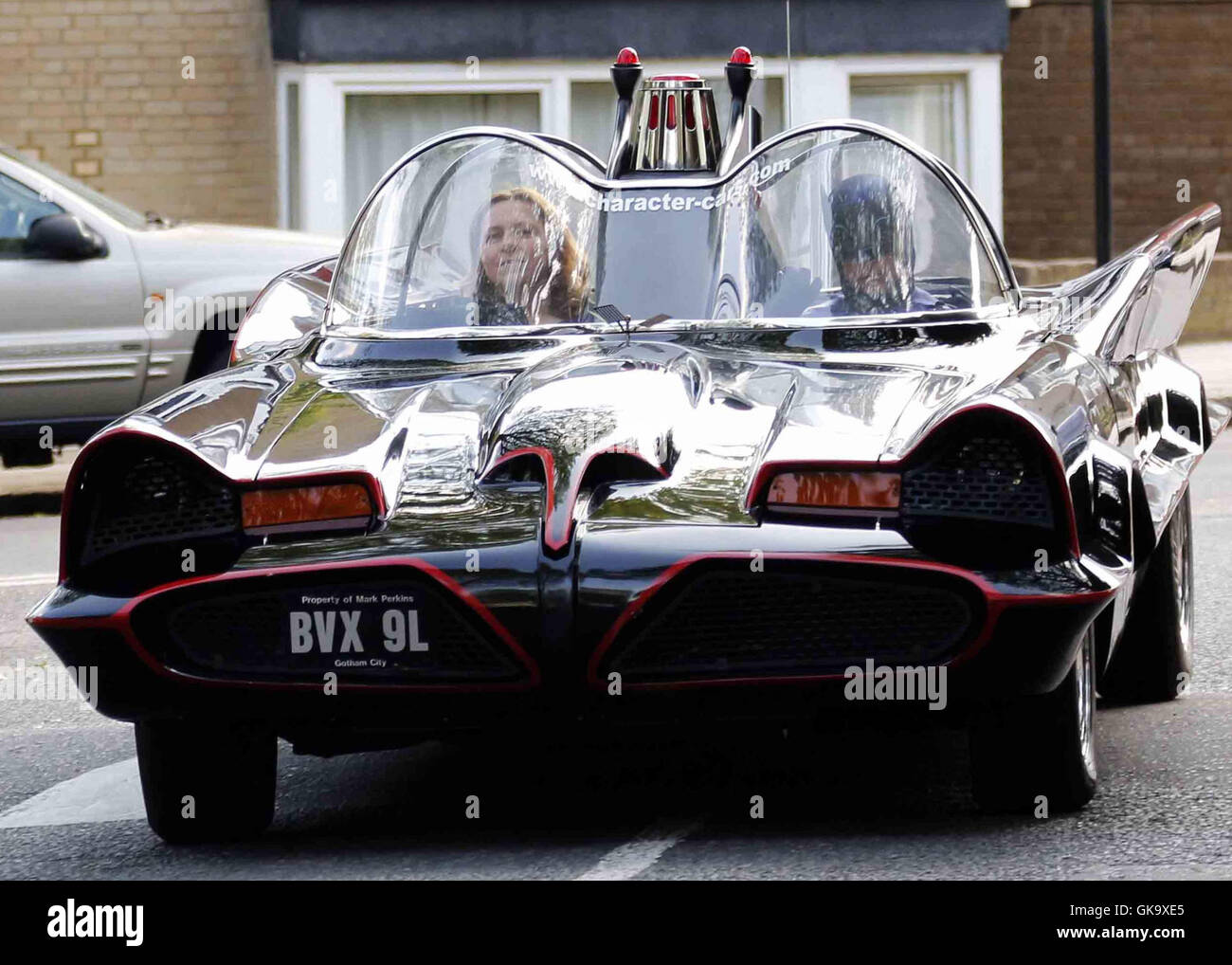 A lady is seen taking a ride in a replica 1966 Batmobile in Belsize ...