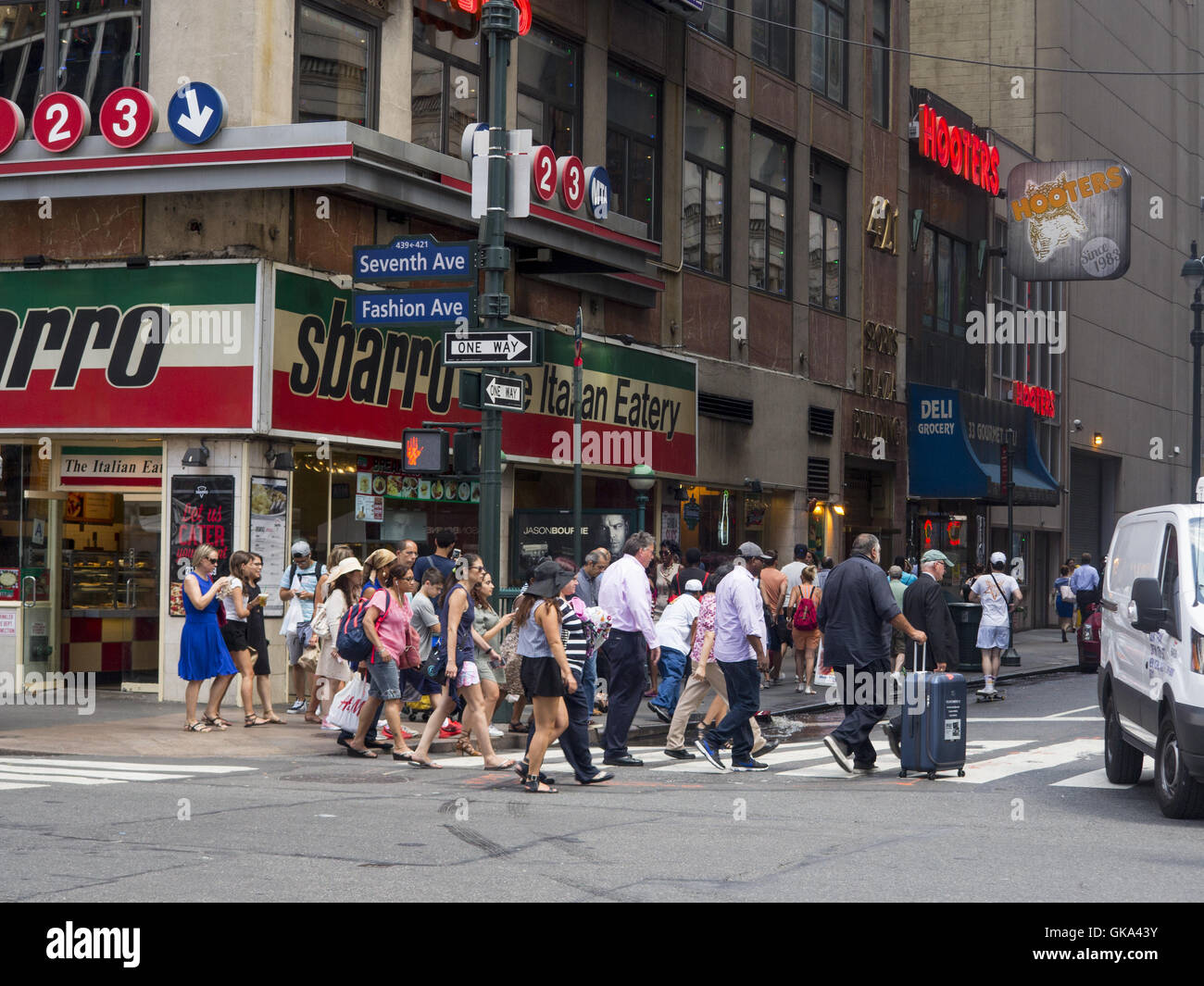 The bustling neighborhood of 7th Ave near Penn Station in midtown ...