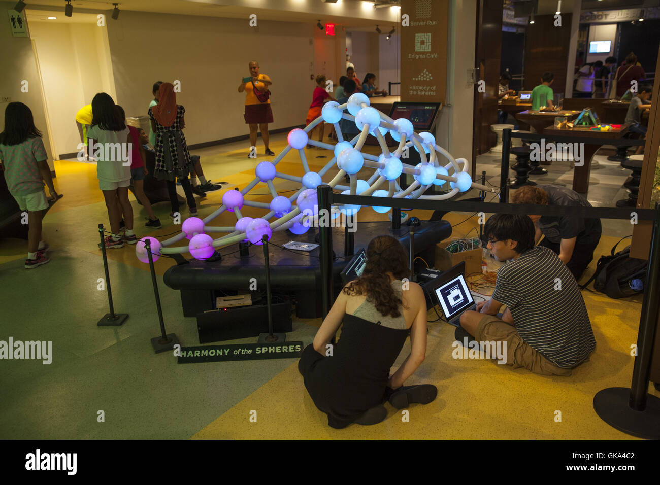 Children and adults explore mathematically based interactive exhibits ...