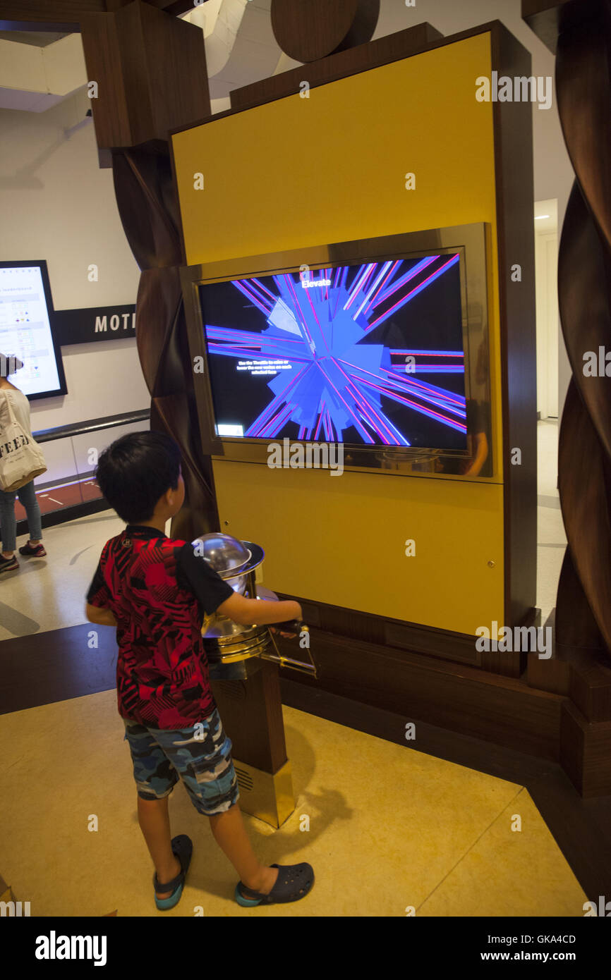 Children and adults explore mathematically based interactive exhibits ...