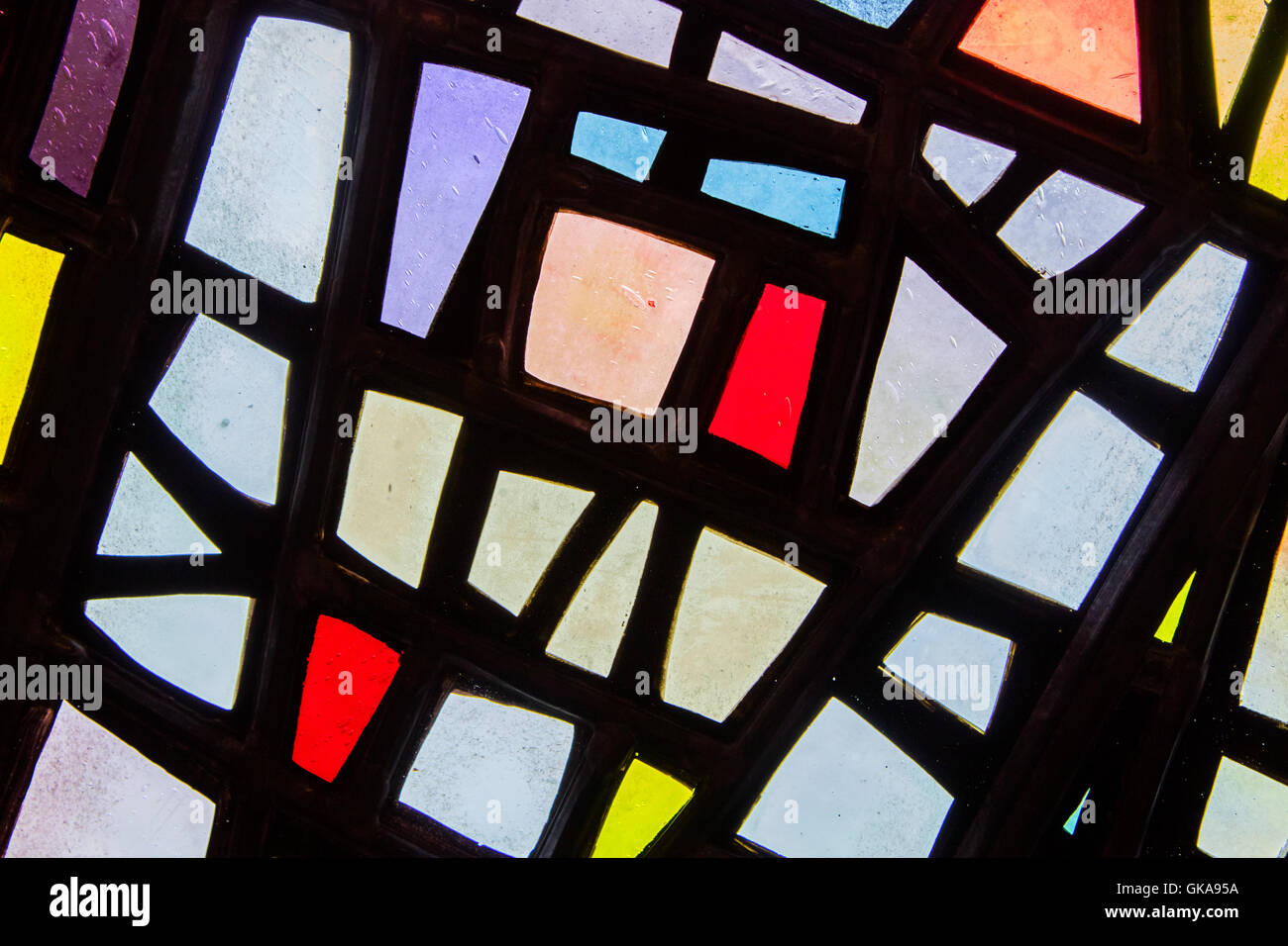 Image of a multicolored stained glass window with irregular block ...