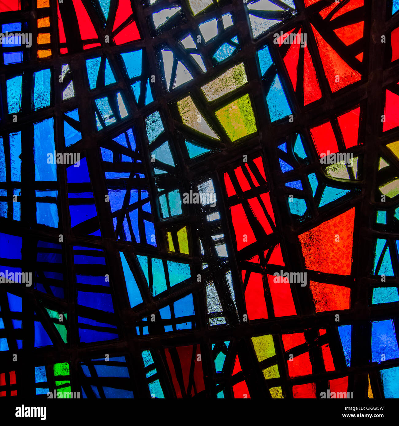 Image of a multicolored stained glass window with irregular block ...