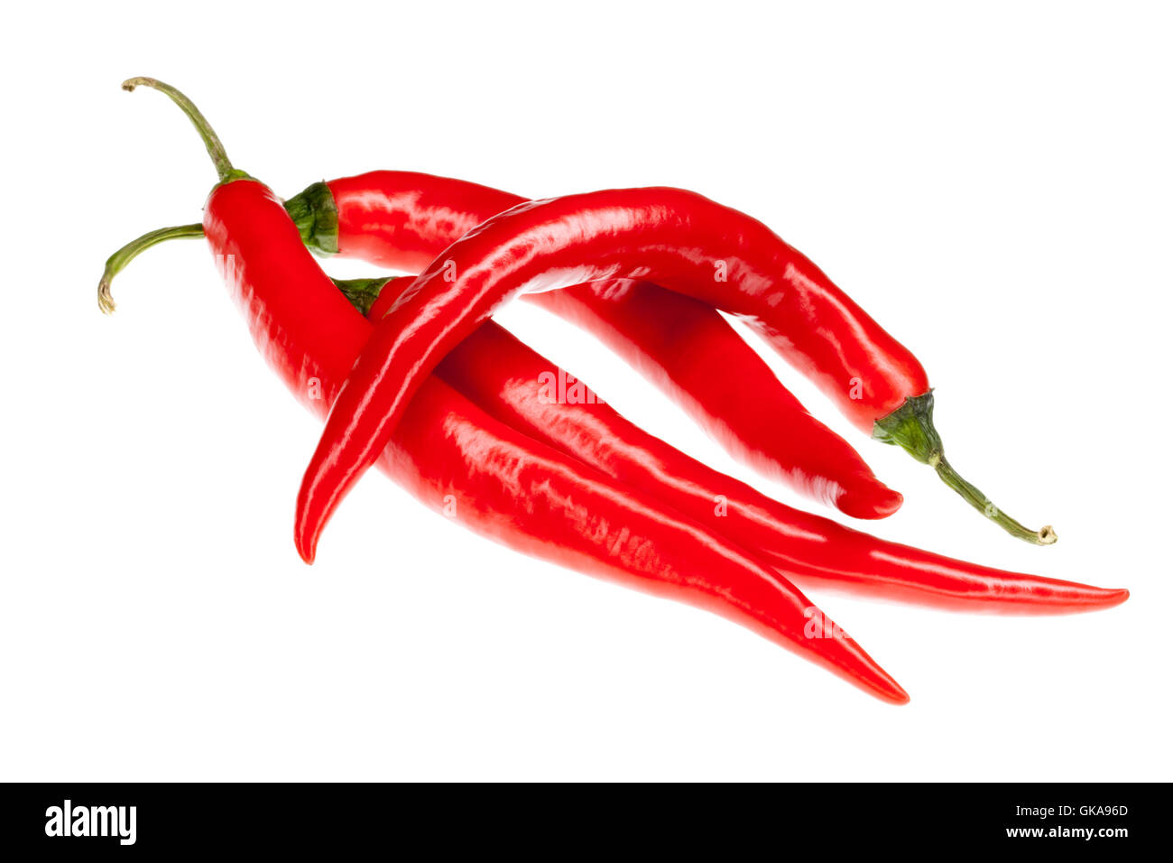red fresh chili peppers isolated Stock Photo - Alamy