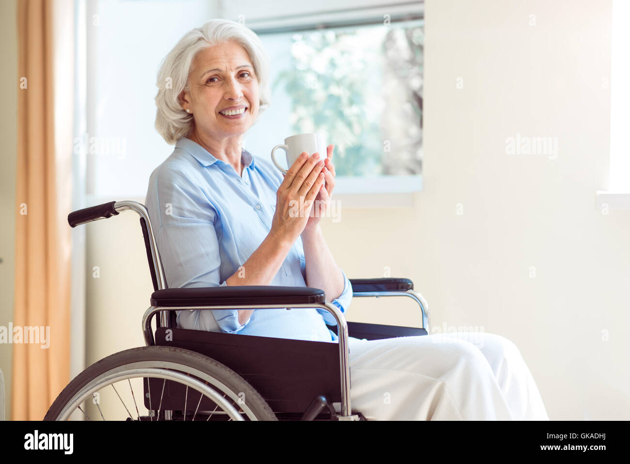Senior woman in wheelchair Stock Photo - Alamy
