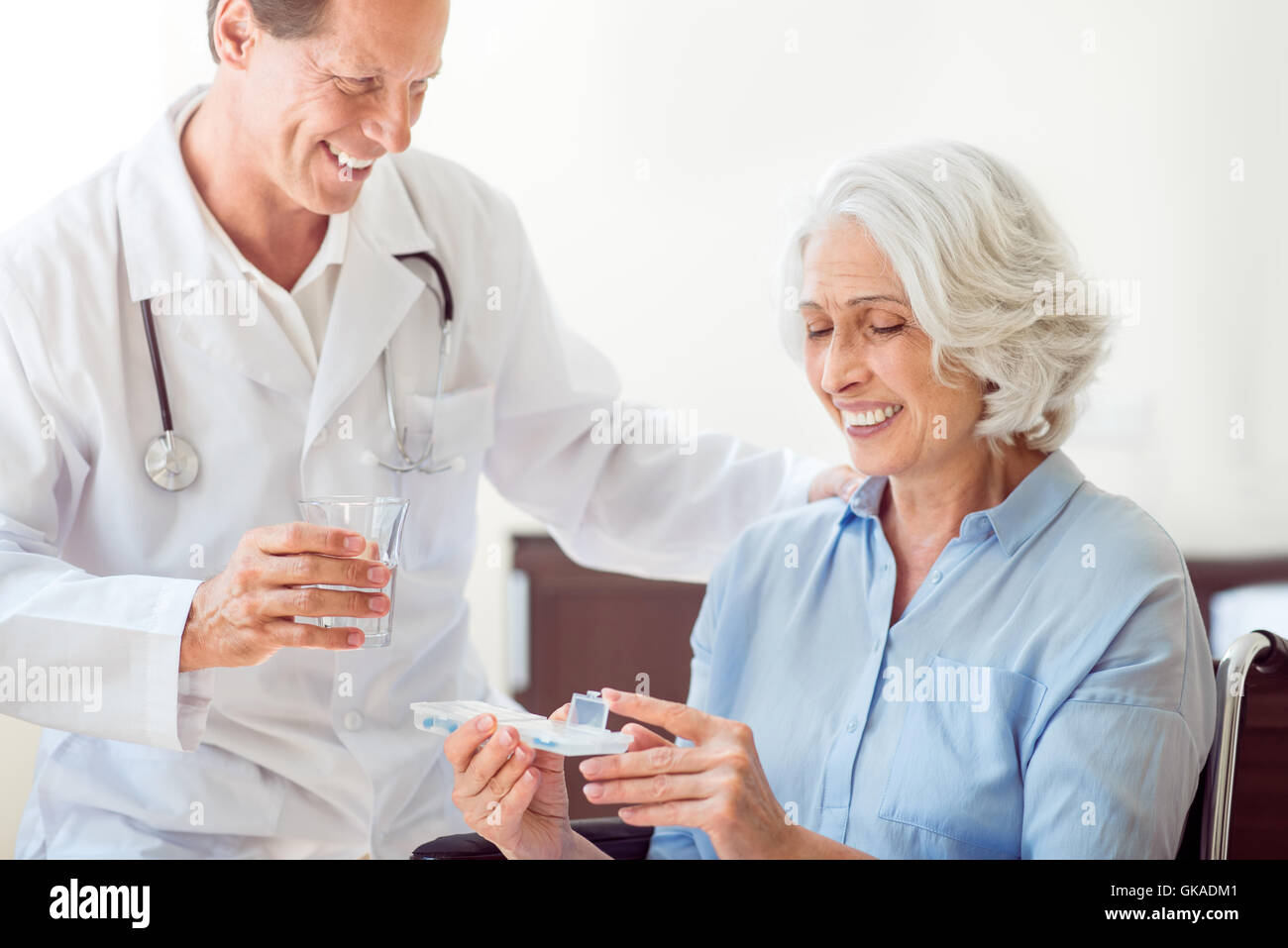 Kind doctor giving pills Stock Photo - Alamy