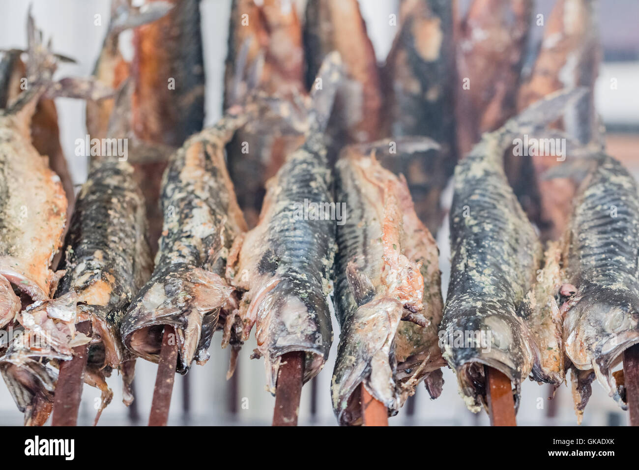 Roasted fish on a stick Stock Photo - Alamy