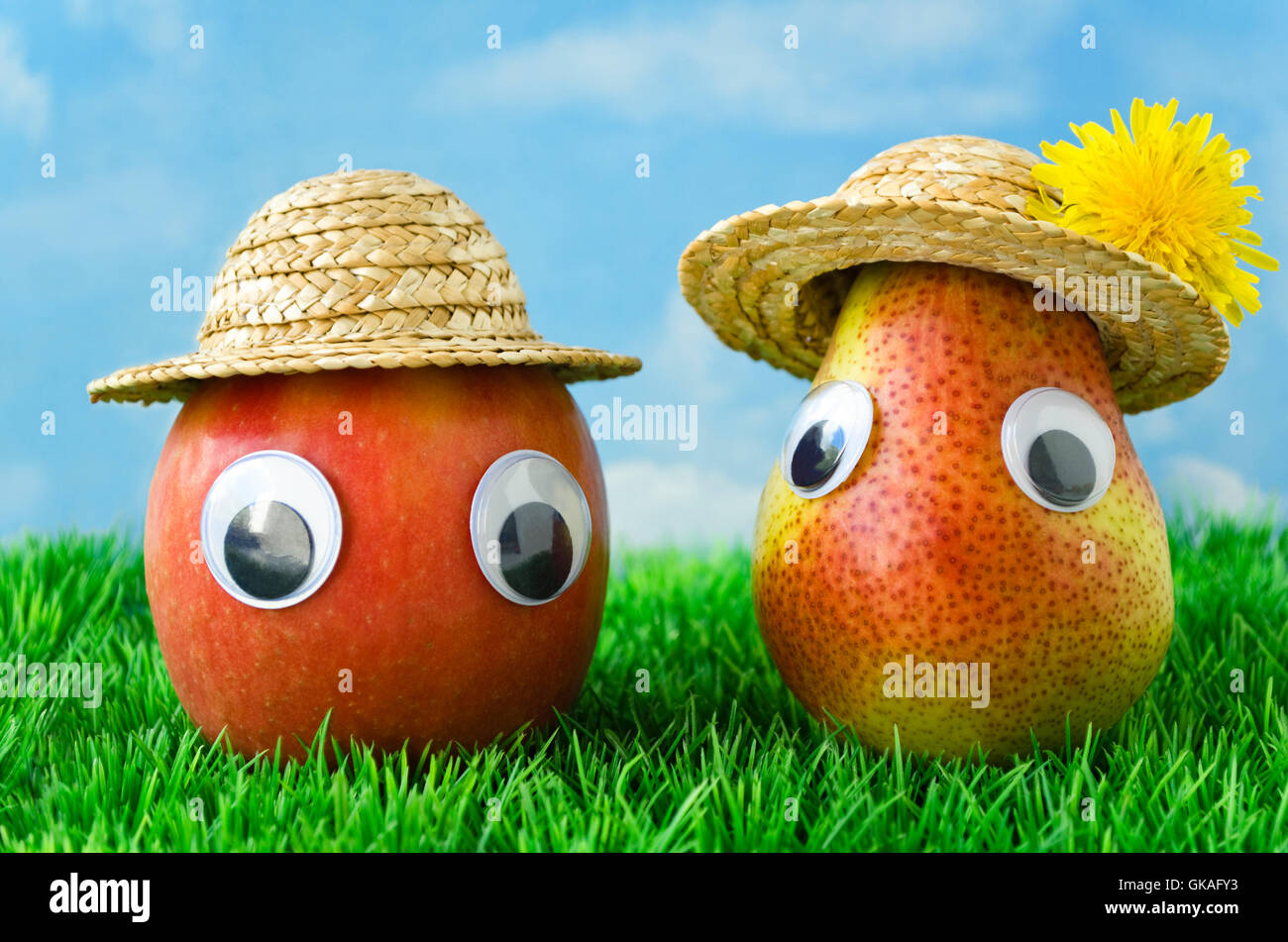 apple and pear with face and straw hat Stock Photo - Alamy