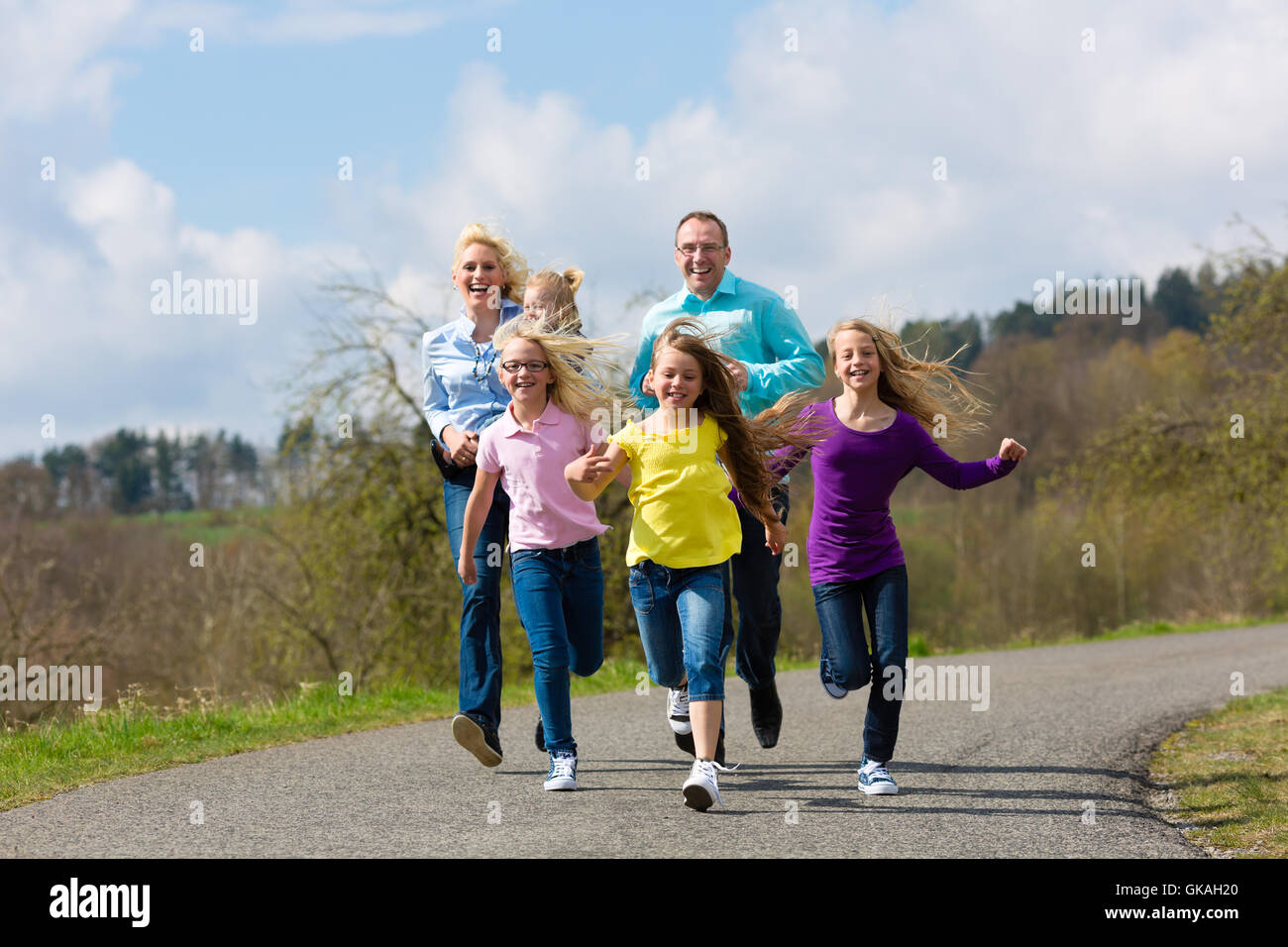 family jogging outdoors Stock Photo - Alamy