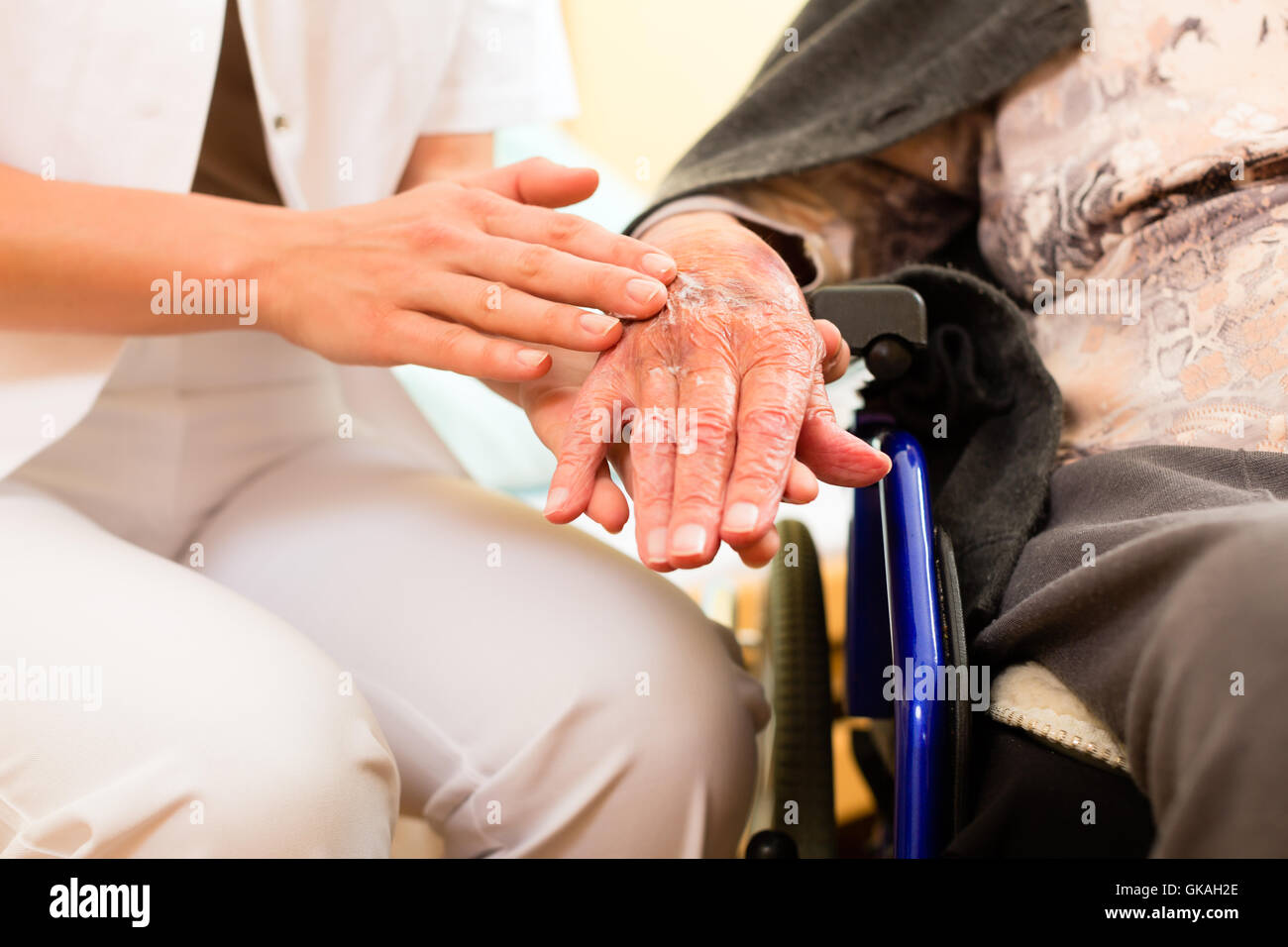 age and care - nurse and a senior citizen retirement home Stock Photo ...