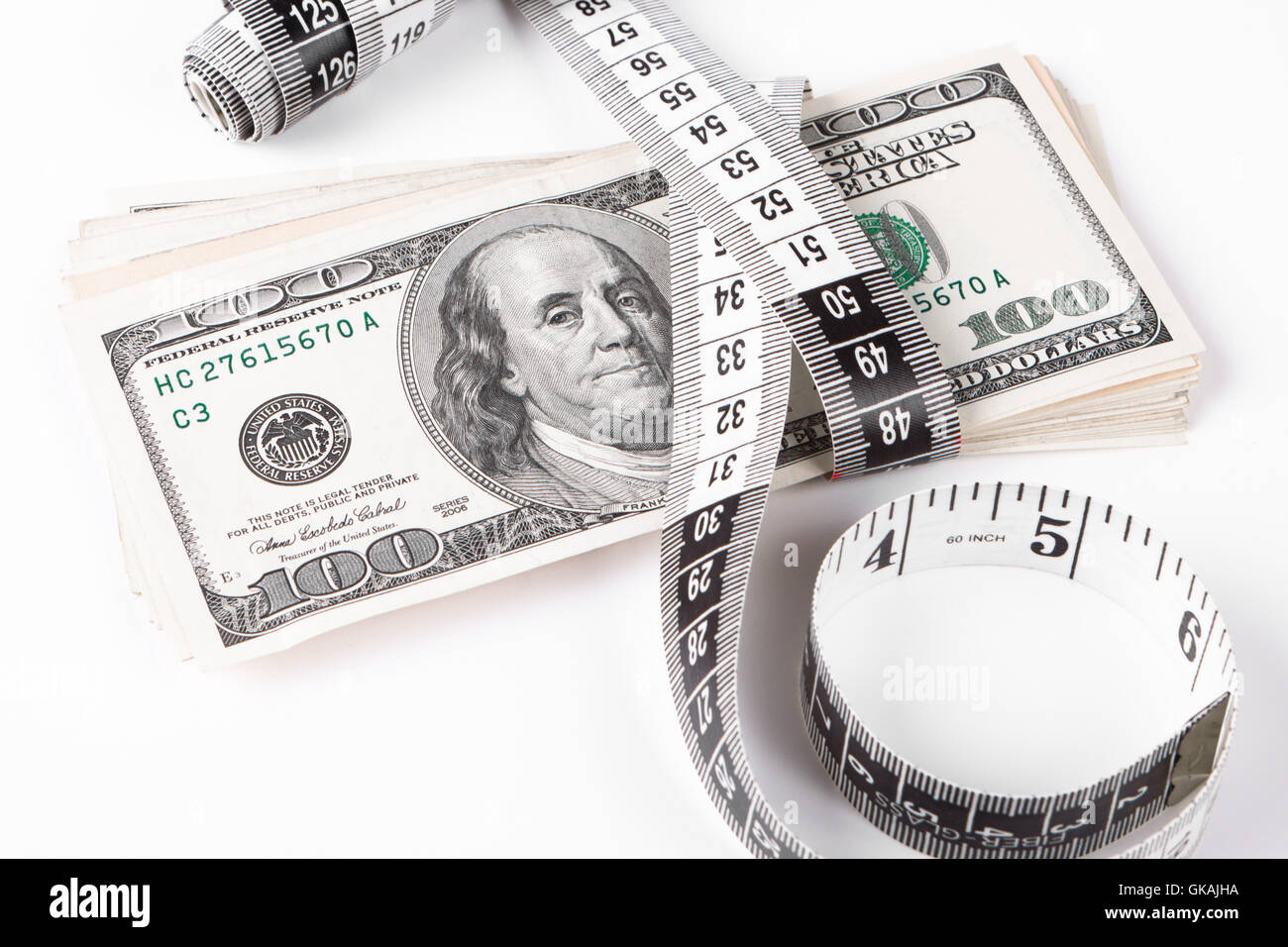 Dollar bill and tape measure hi-res stock photography and images - Alamy
