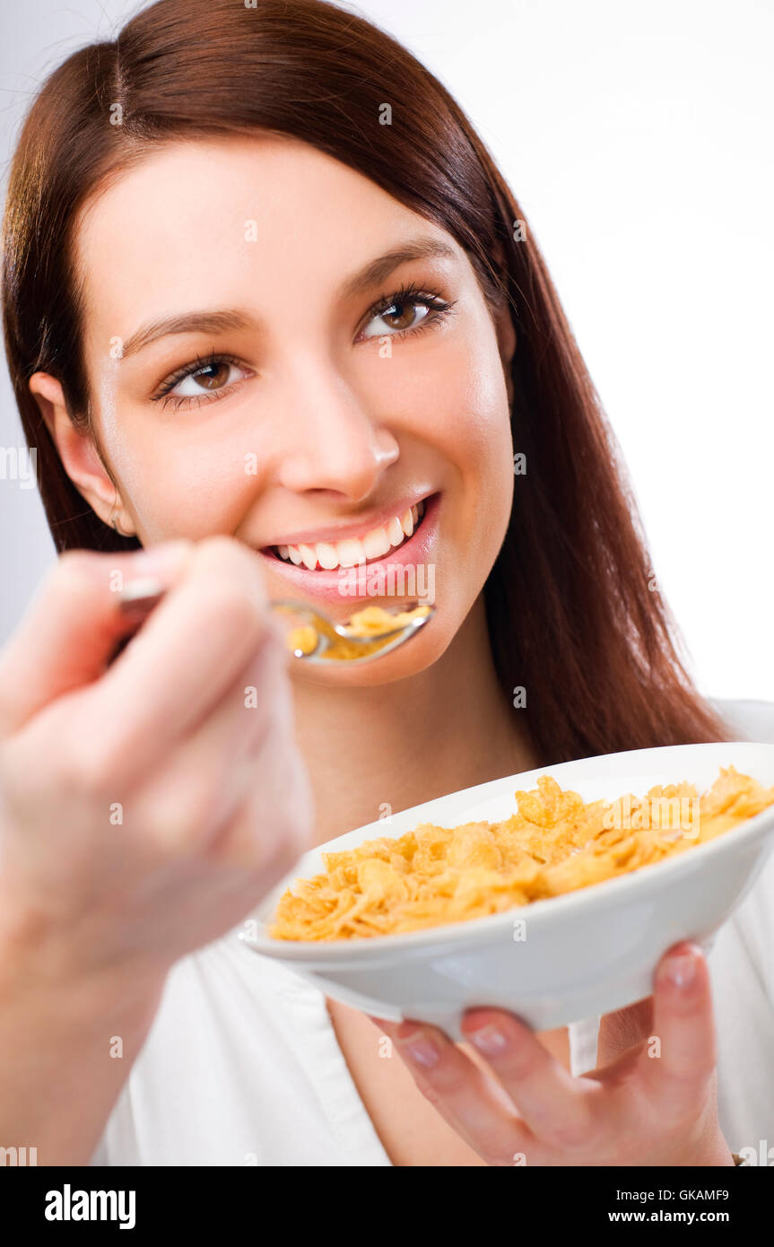 Pretty smiling girl eats hi-res stock photography and images - Alamy