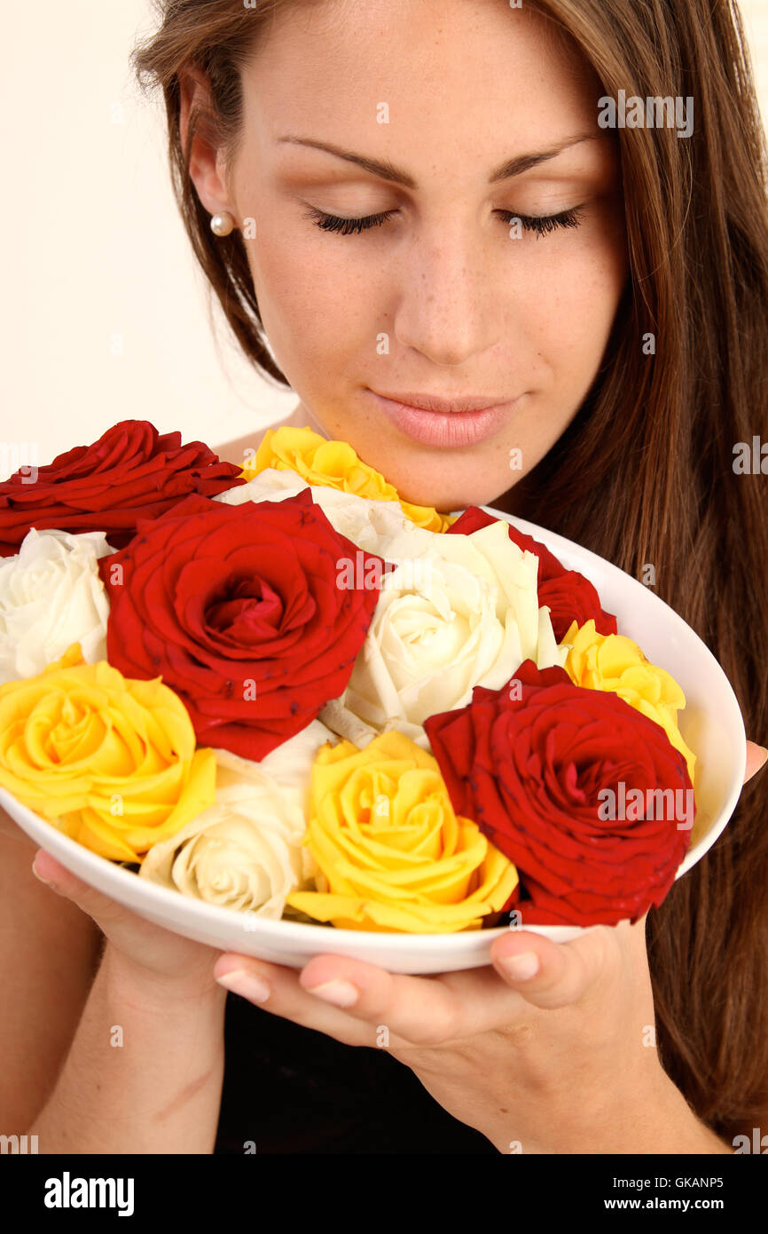 woman smelling roses Stock Photo - Alamy