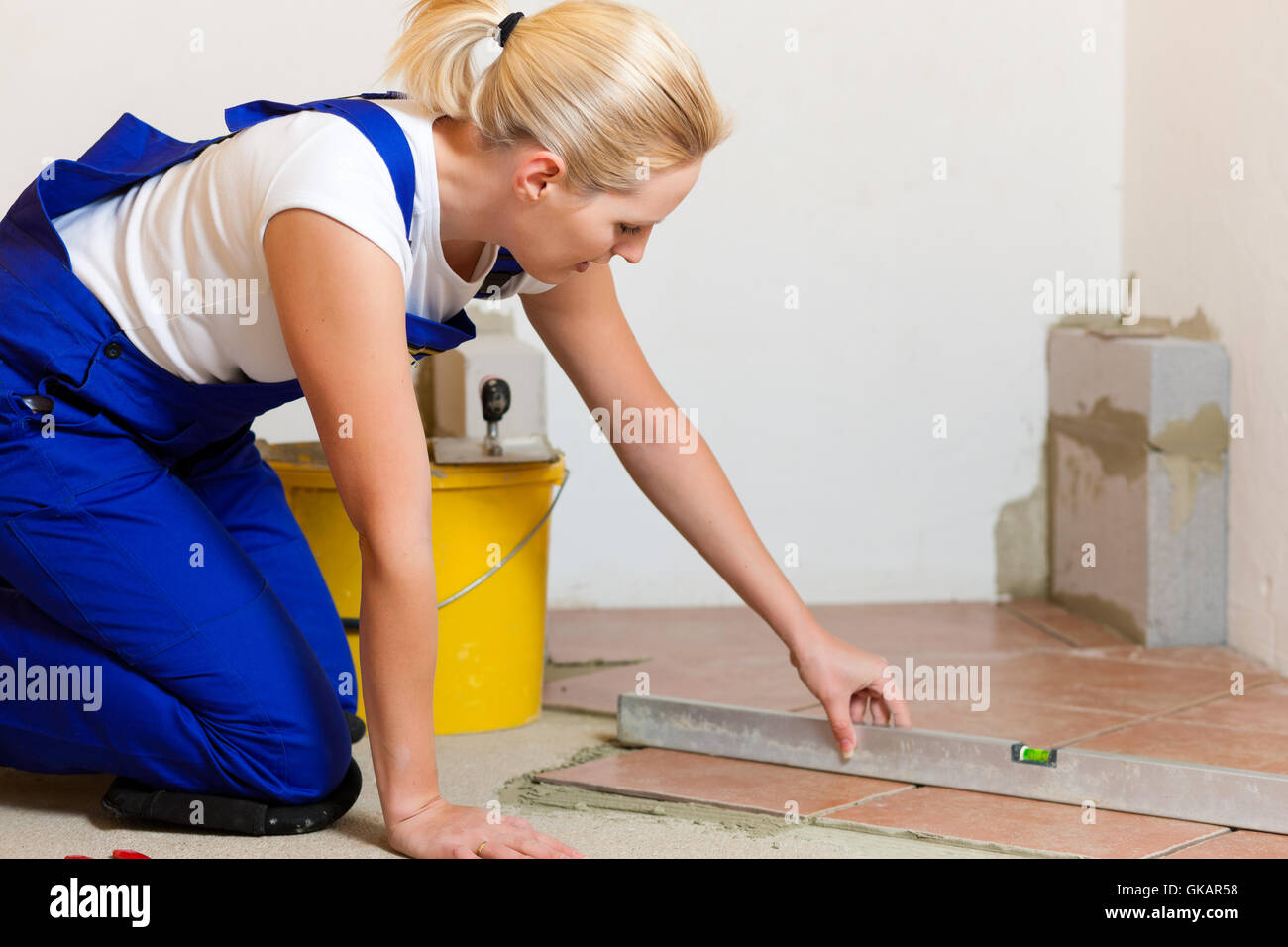 Woman tiling diy hi-res stock photography and images - Alamy