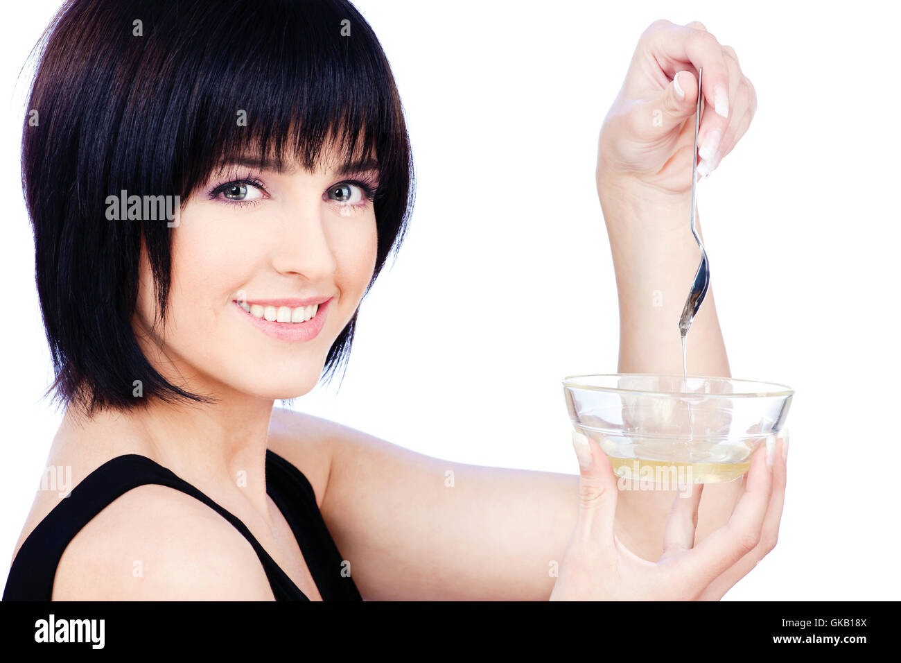 Beautiful woman eating honey hi-res stock photography and images - Alamy