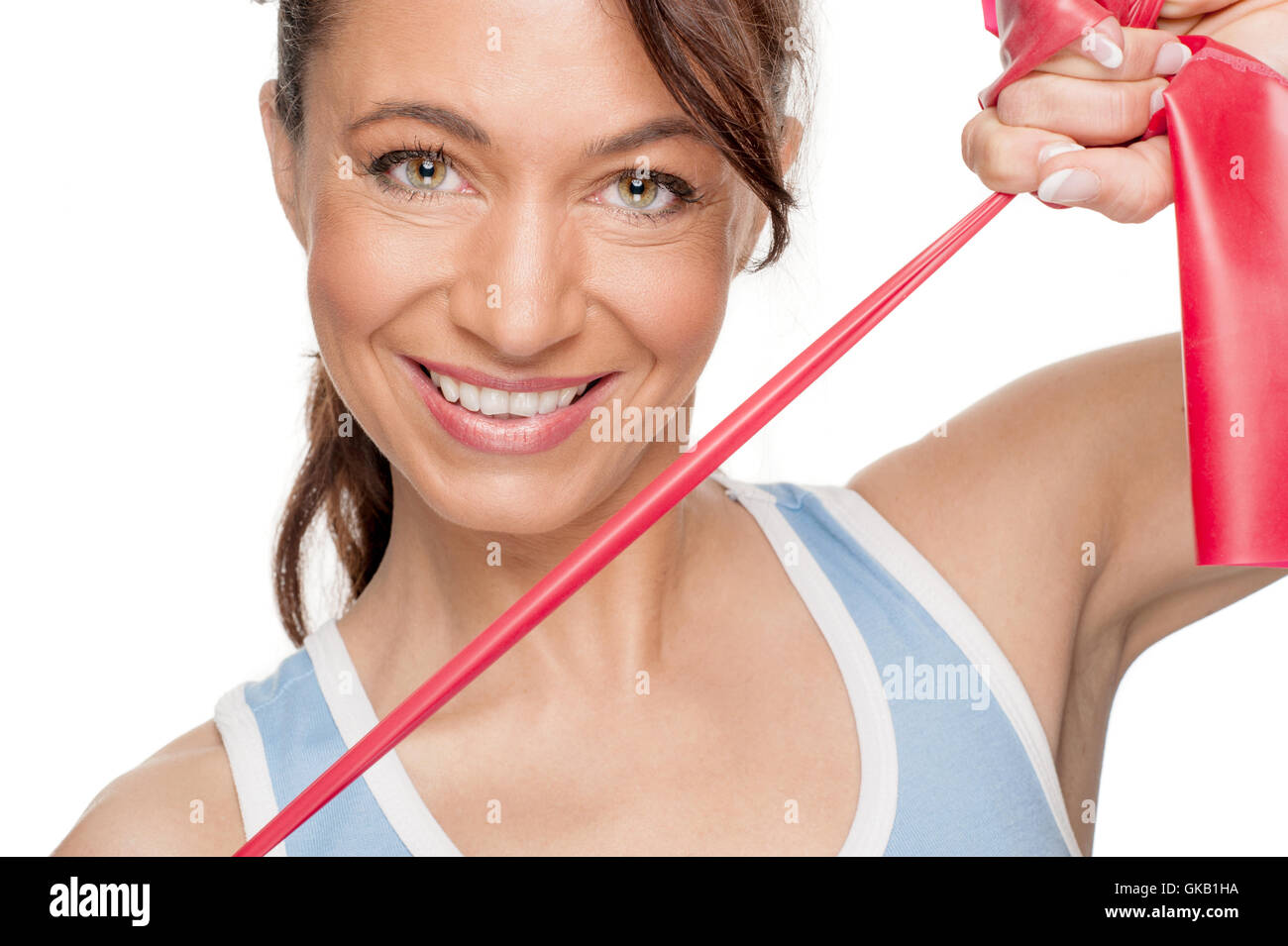 woman with red exercise band Stock Photo - Alamy
