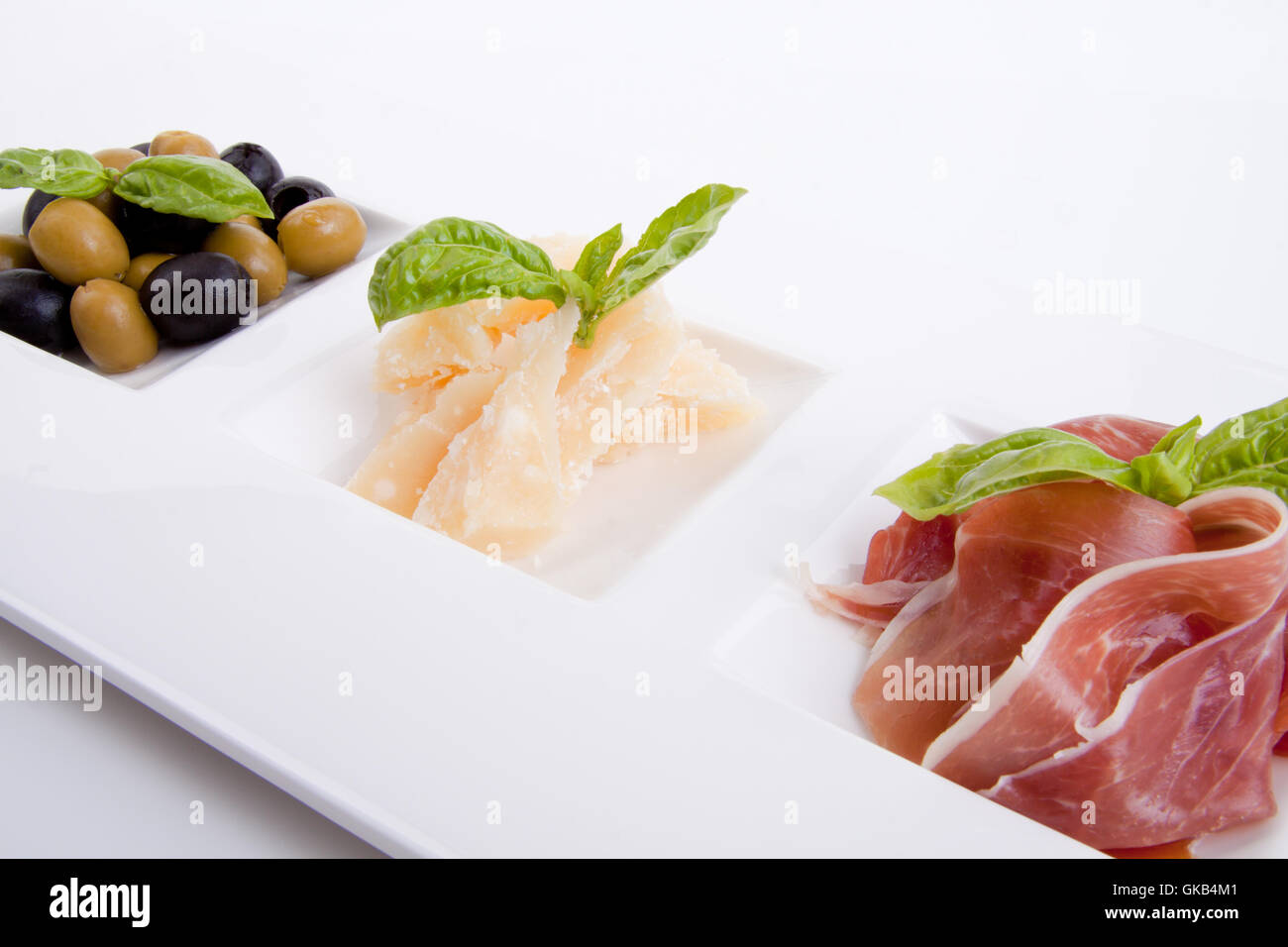 mixed appetizer plate with parma parmesan tomato olives on Stock Photo ...