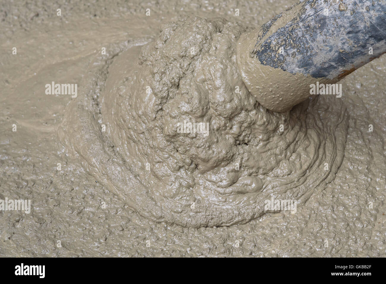 Concrete pumping hose filling foundation hole Stock Photo - Alamy