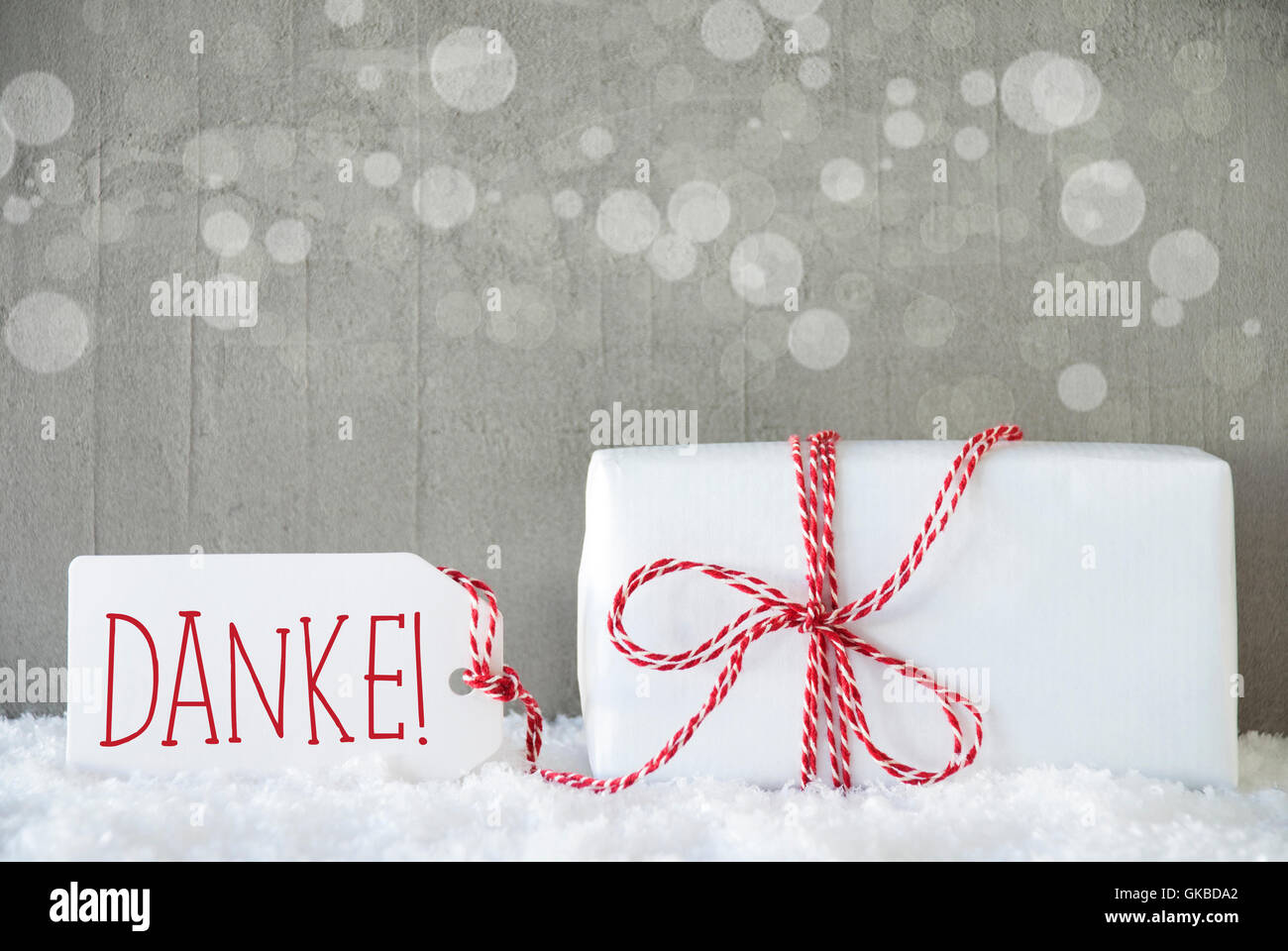 Gift, Cement Background With Bokeh, Danke Means Thank You Stock Photo ...