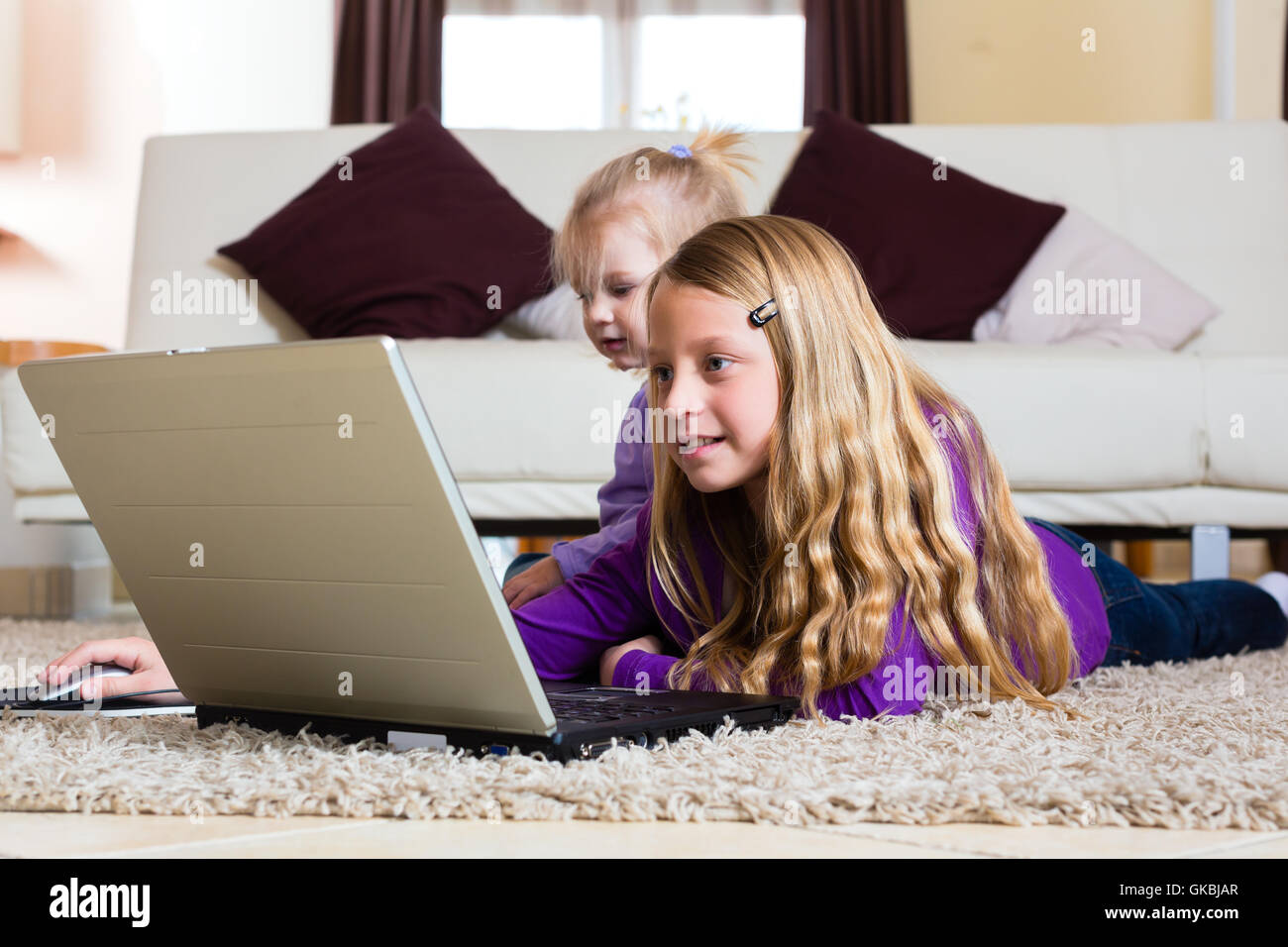 family - child playing with the laptop Stock Photo - Alamy