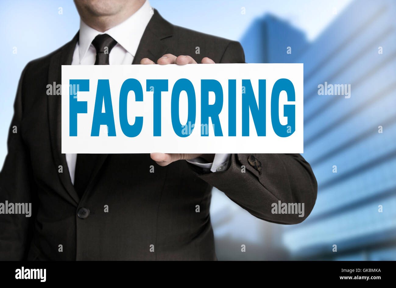 factoring sign is held by businessman Stock Photo - Alamy