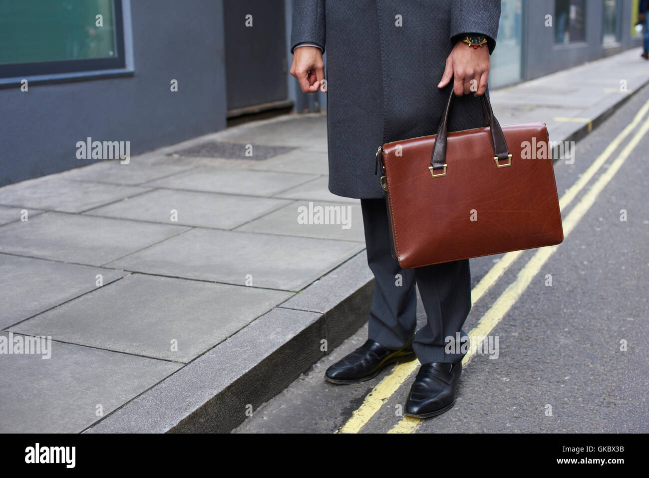 Businessman holding briefcase close hi-res stock photography and images ...