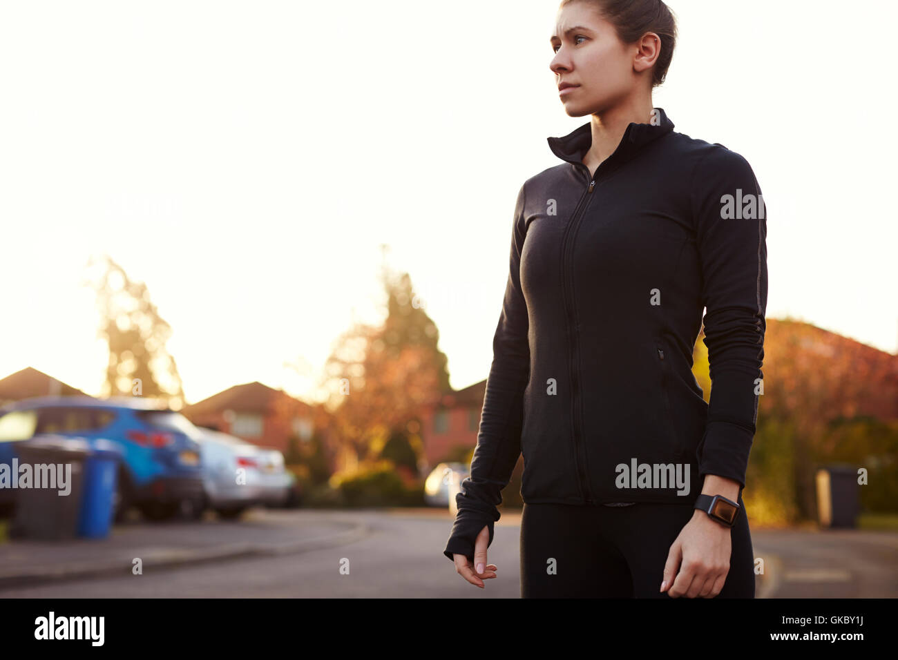 Woman On Early Morning Run In Urban Setting Stock Photo - Alamy