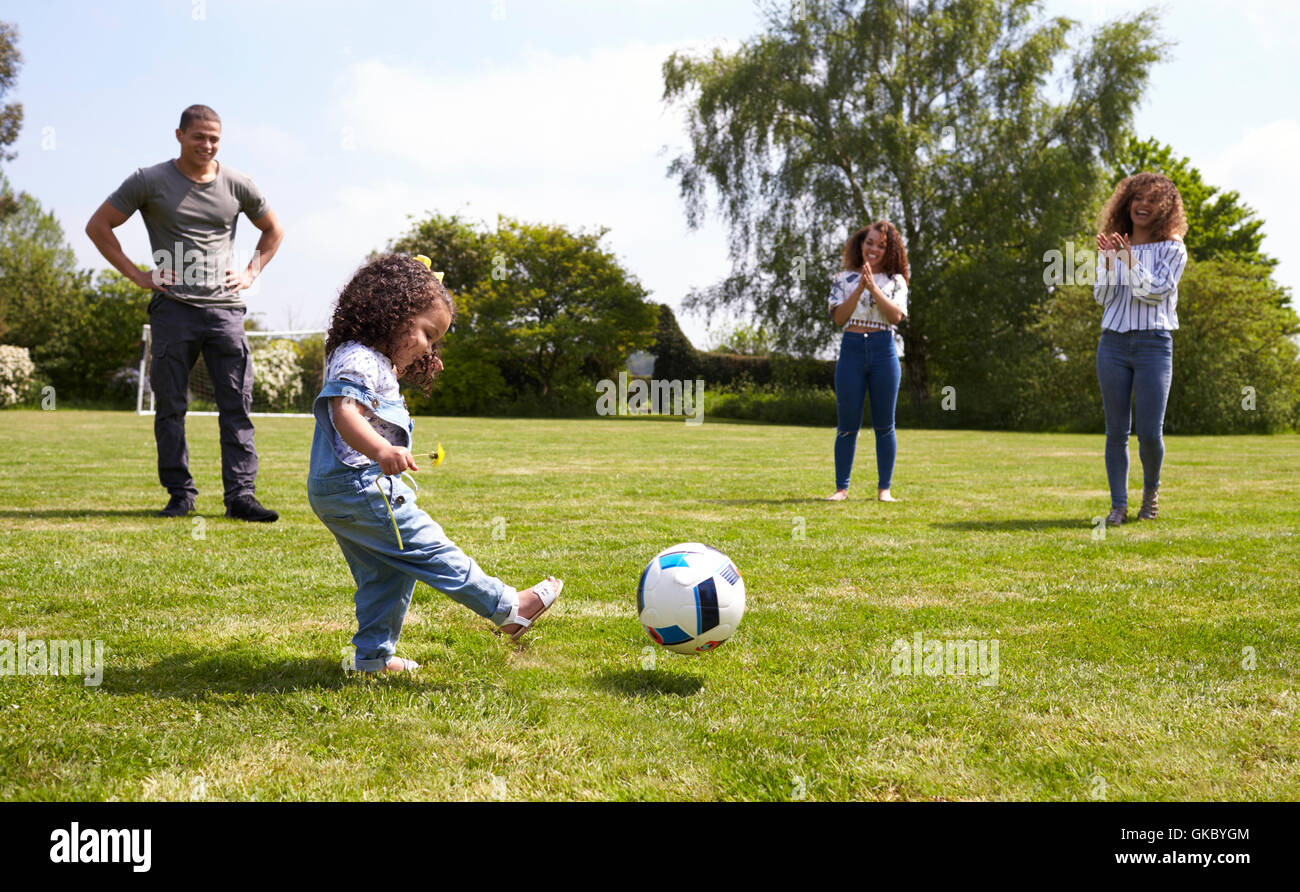 African american toddler kicking ball hi-res stock photography and ...