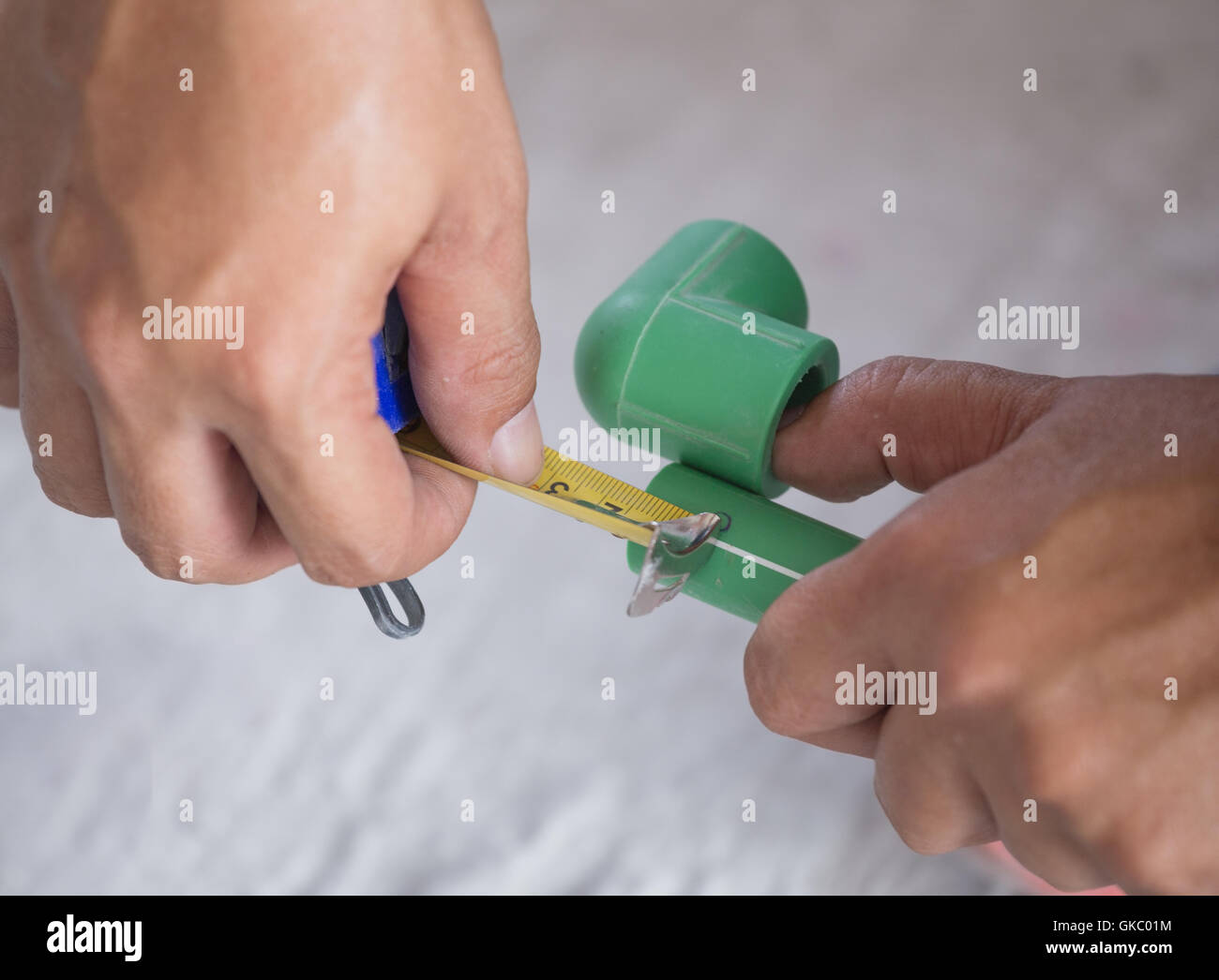 green PPR plumbing pipe with measuring tape Stock Photo - Alamy