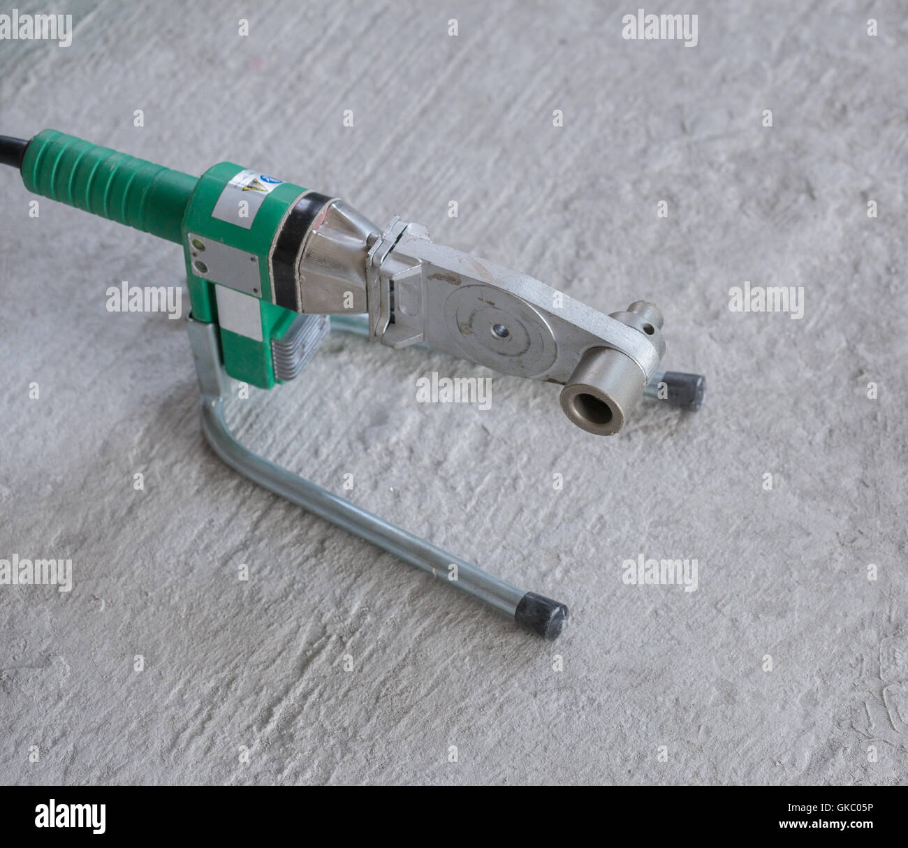 tools for welding plastic pipe at construction site Stock Photo - Alamy